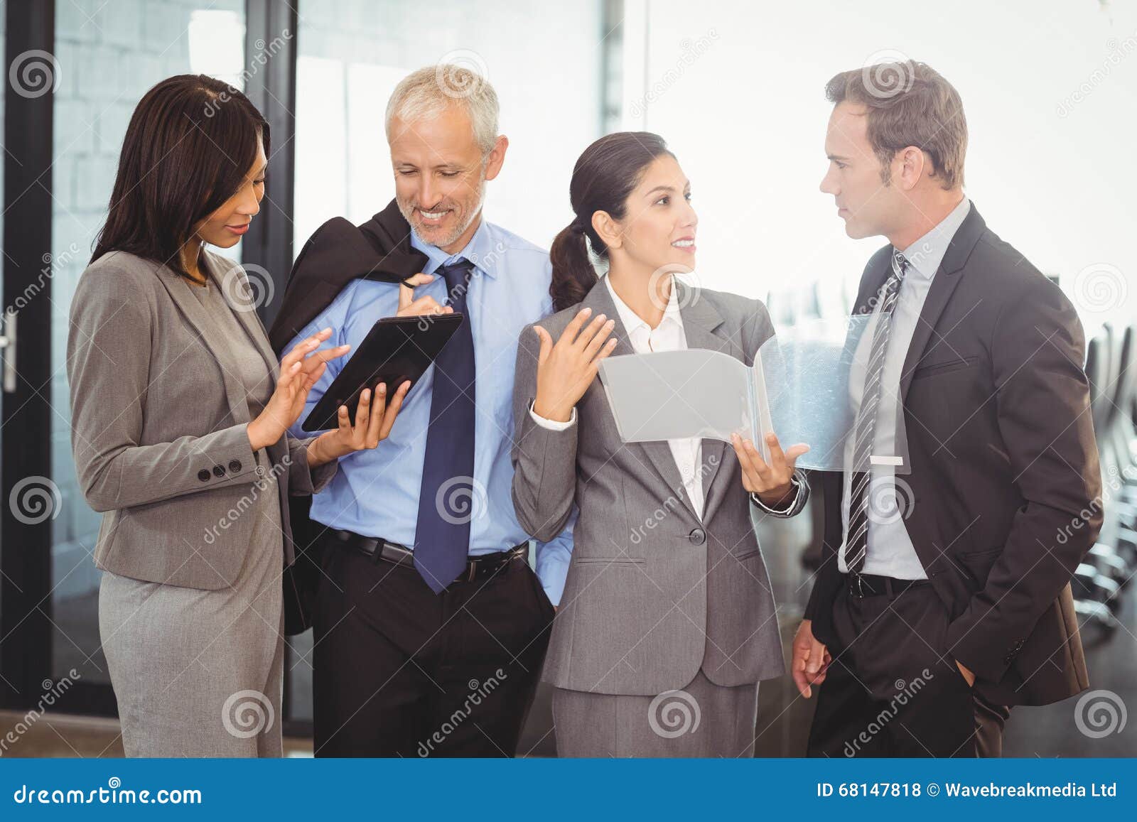 Businesspeople Interacting in Office Stock Photo - Image of executive ...