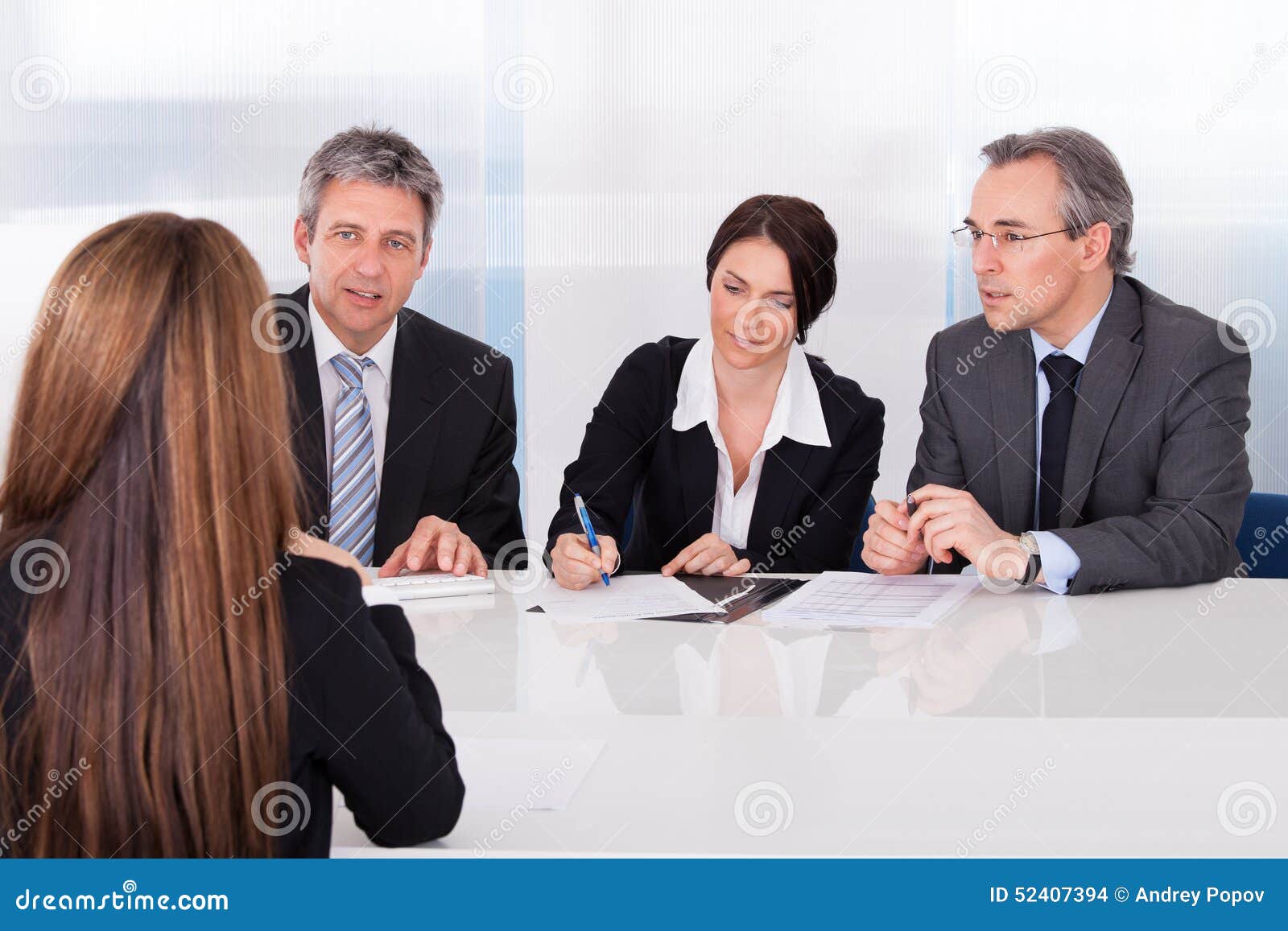 Businesspeople Interviewing Woman Stock Photo - Image of communication ...