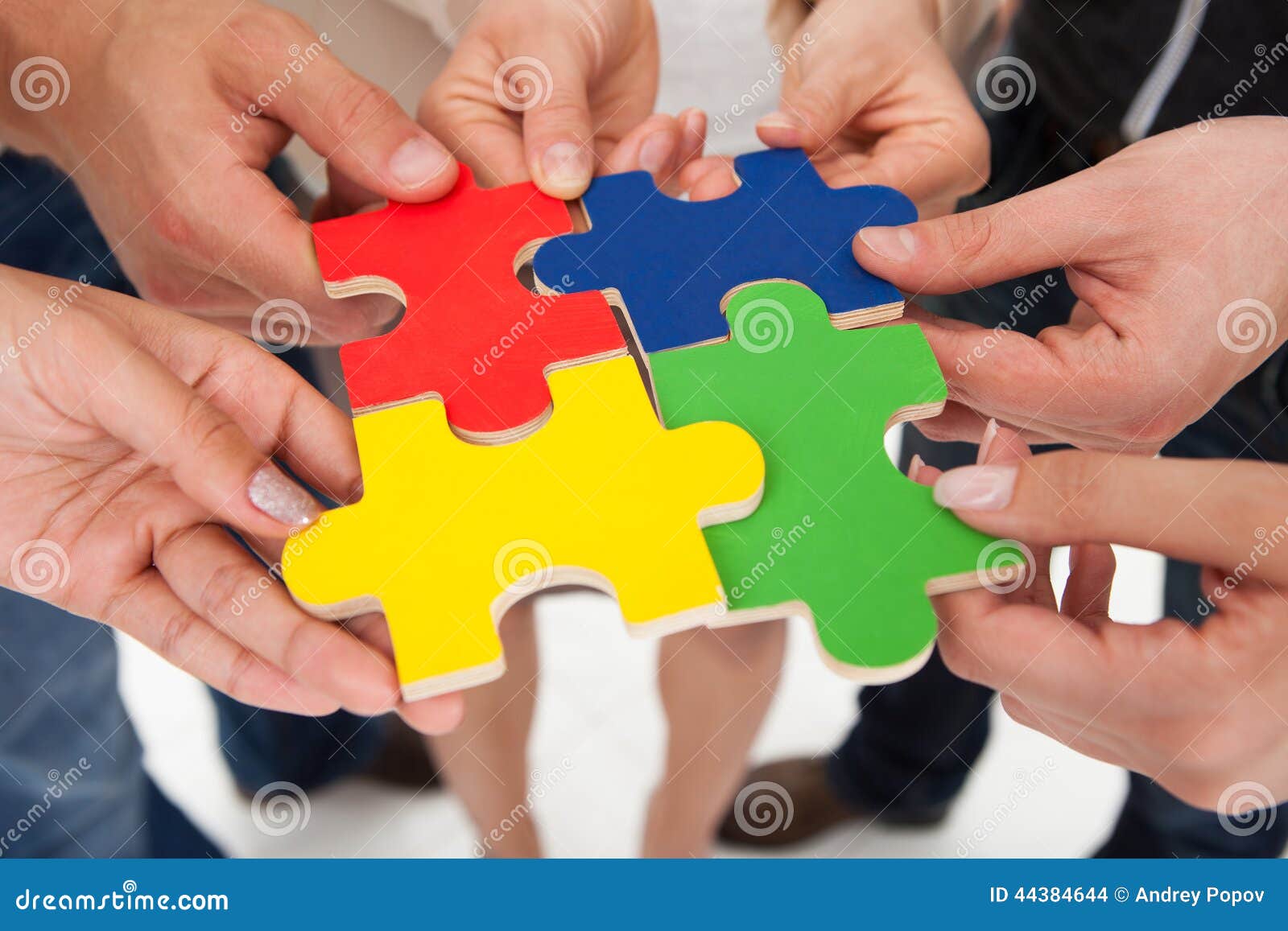 Businesspeople Joining Puzzle Pieces Stock Photo - Image of high ...