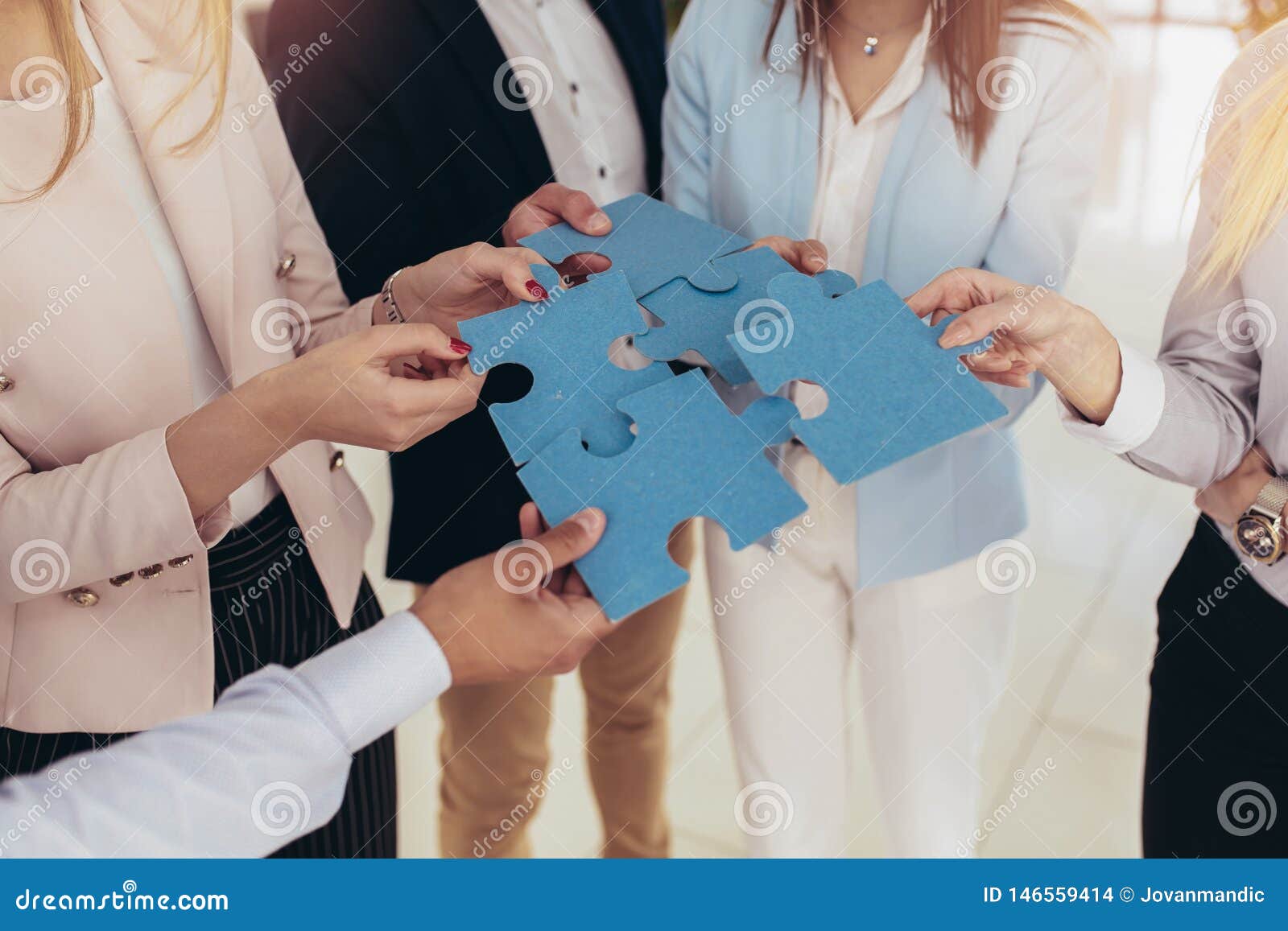 Businesspeople Joining Puzzle Pieces in Office Stock Photo - Image of ...