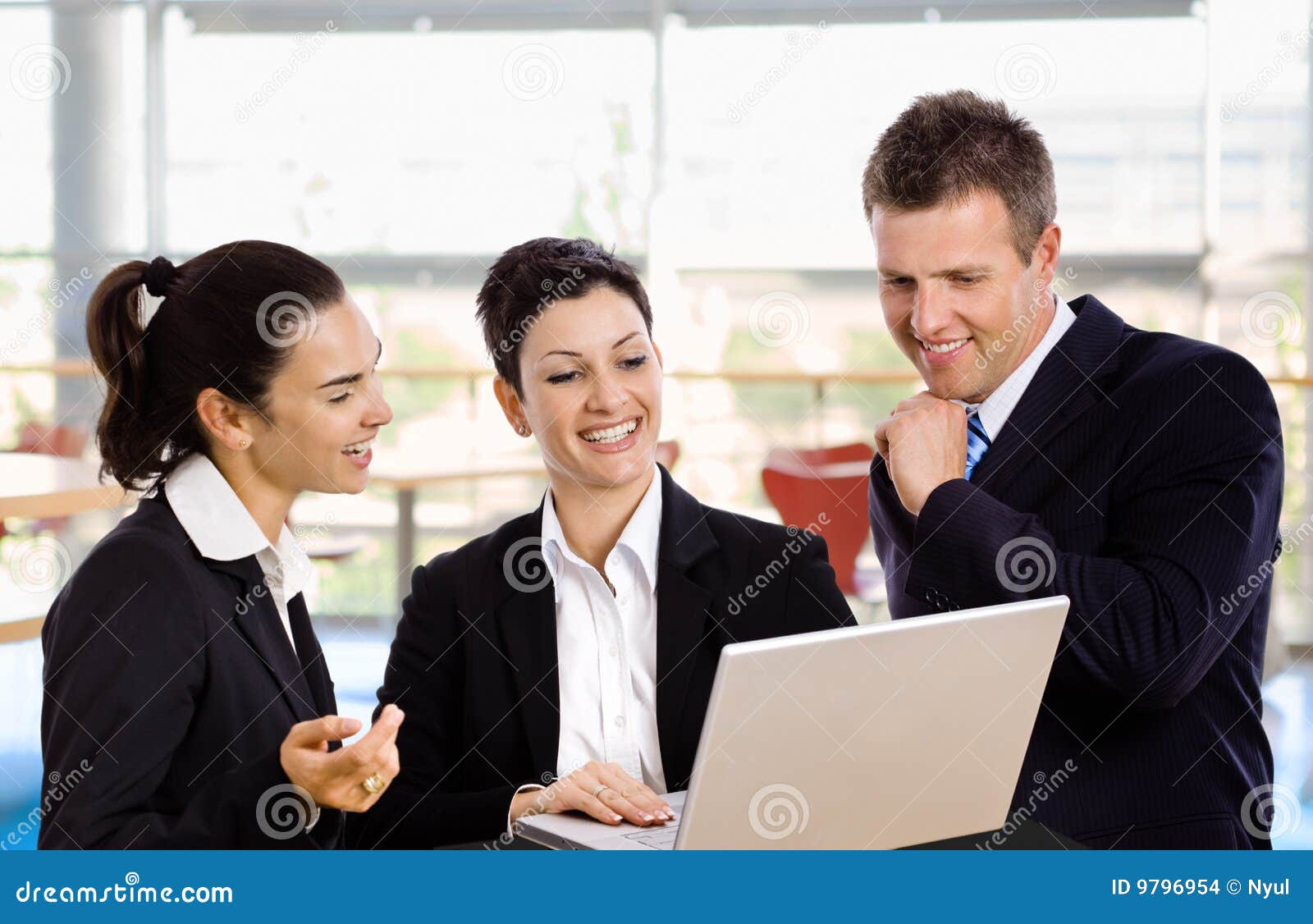Businesspeople with laptop stock photo. Image of career - 9796954