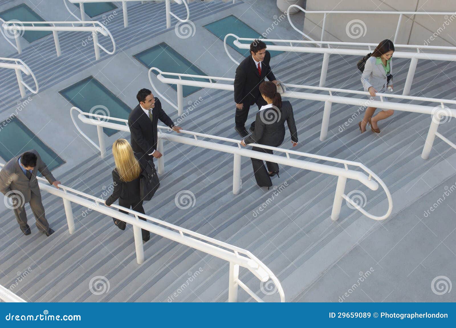 Businesspeople Moving Up and Down Stairs Stock Image - Image of ...
