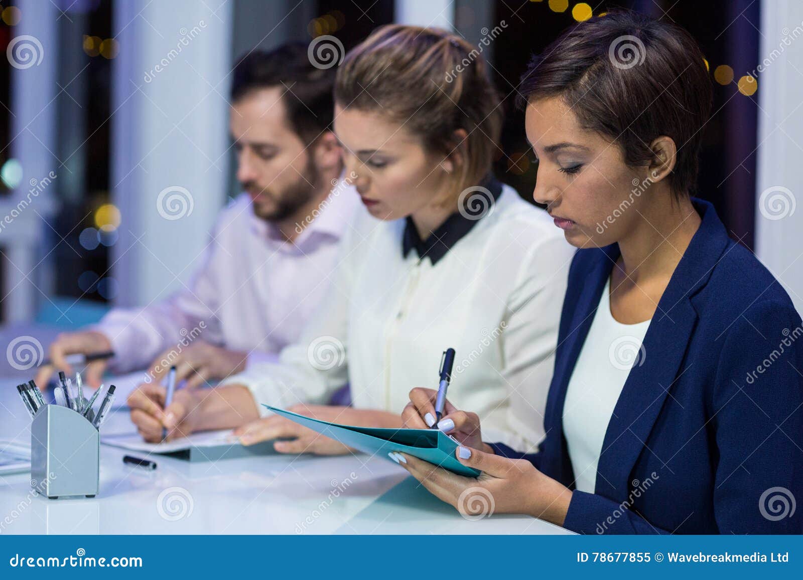 Businesspeople Preparing Document in Office Stock Image - Image of ...