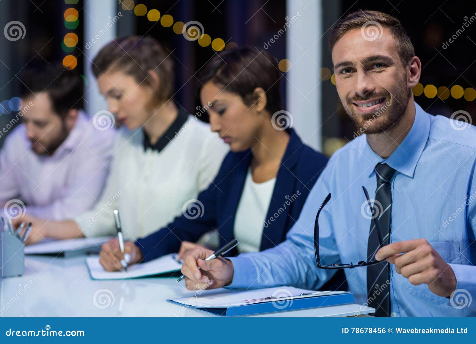 Businesspeople Preparing Document in Office Stock Photo - Image of ...