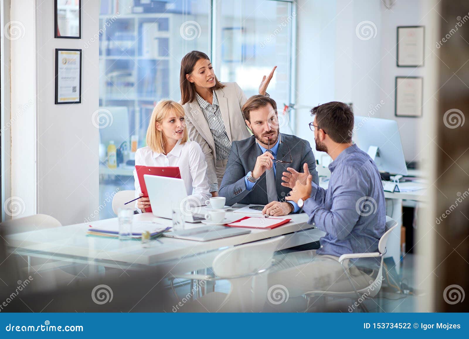 Businesspeople Presenting Ideas To Clients at His Office Stock Photo ...