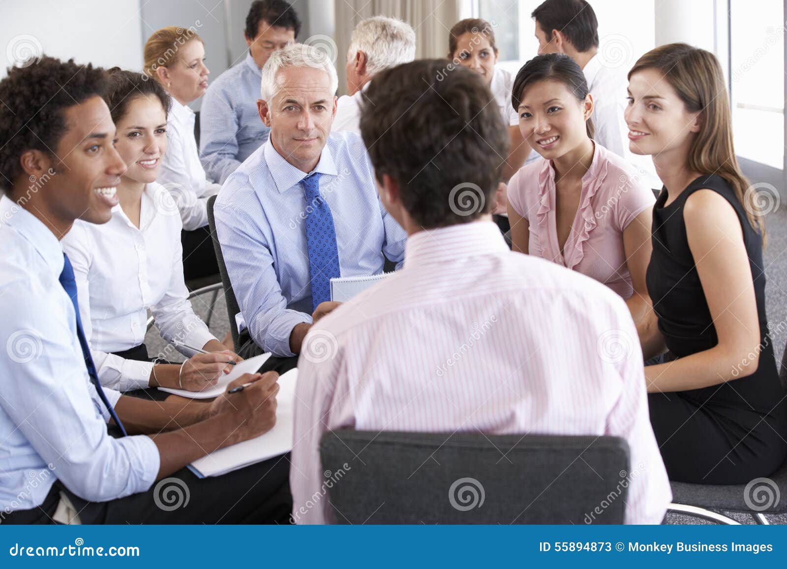 Businesspeople Seated in Circle at Company Seminar Stock Image - Image ...