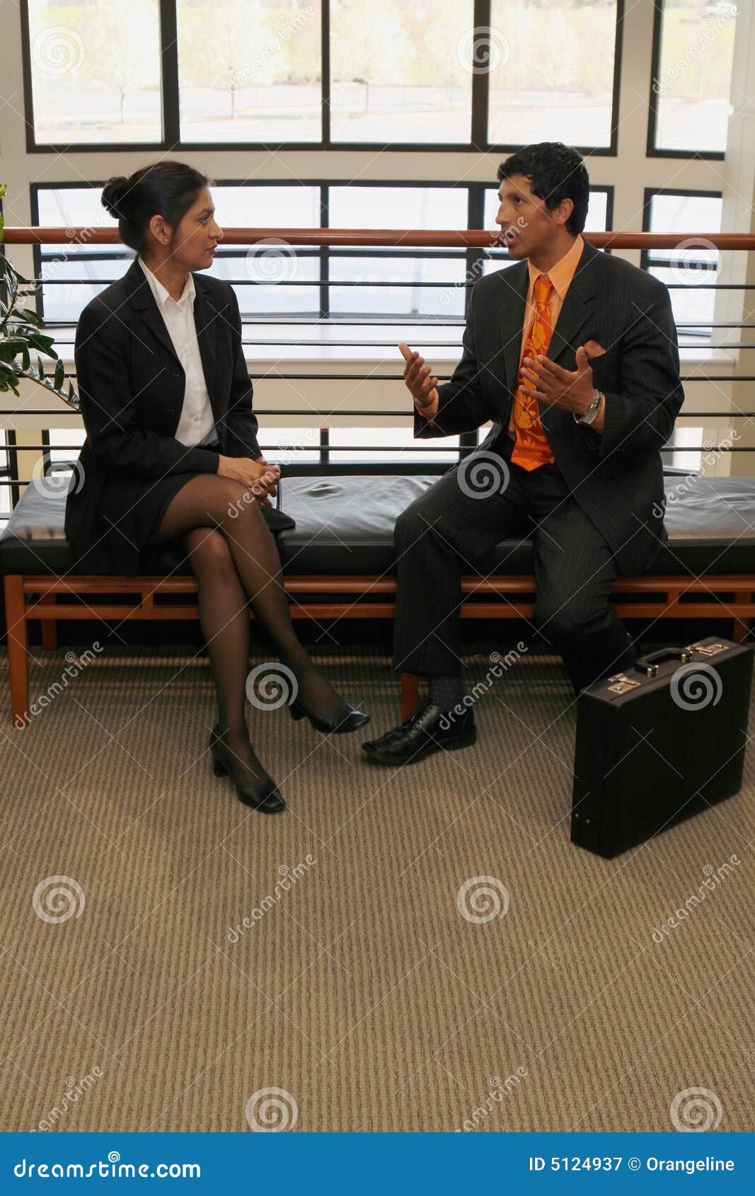Businesspeople Sitting on a Bench Stock Image - Image of lobby, women ...