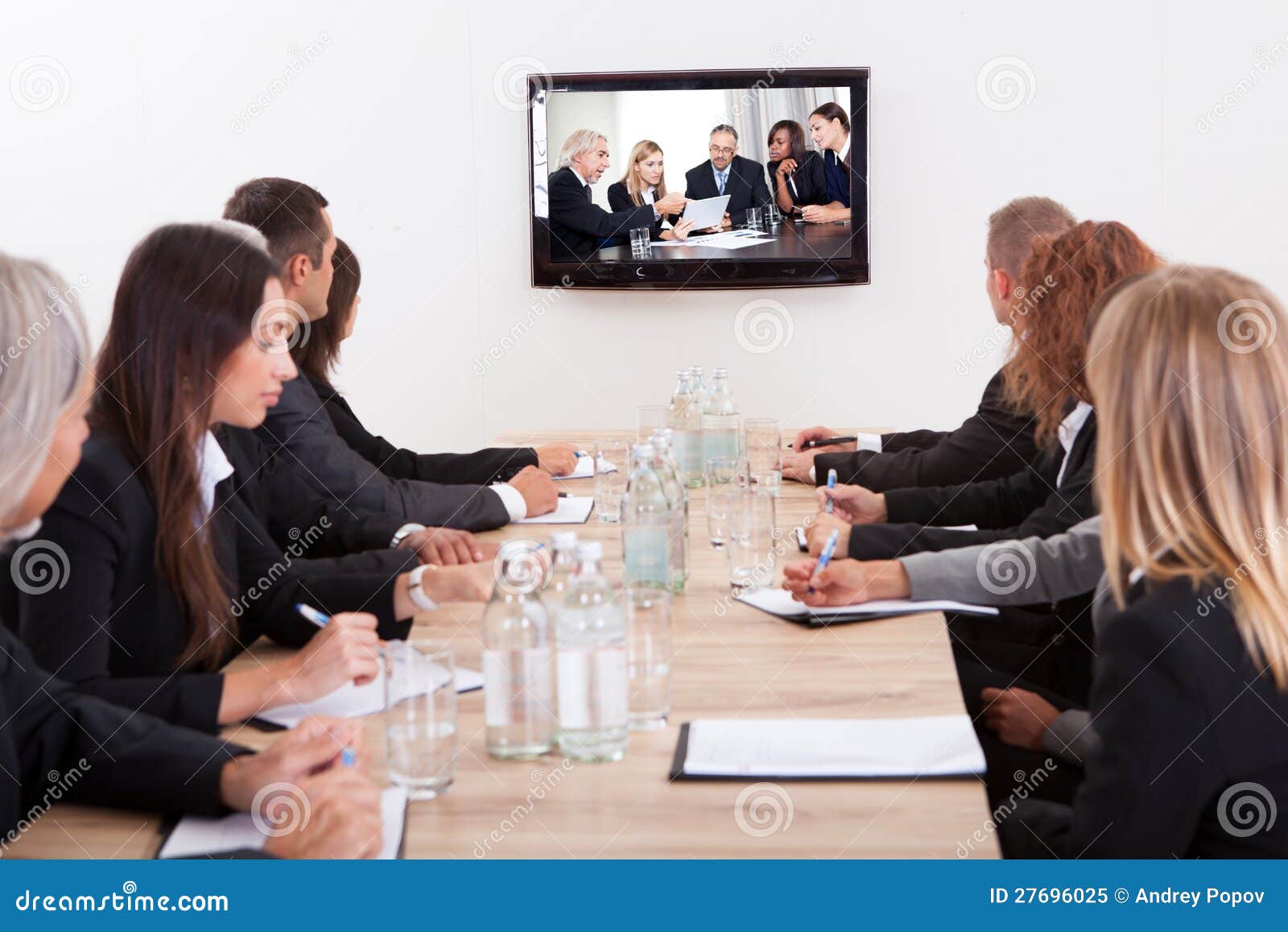 Businesspeople Sitting at Conference Table Stock Image - Image of ...