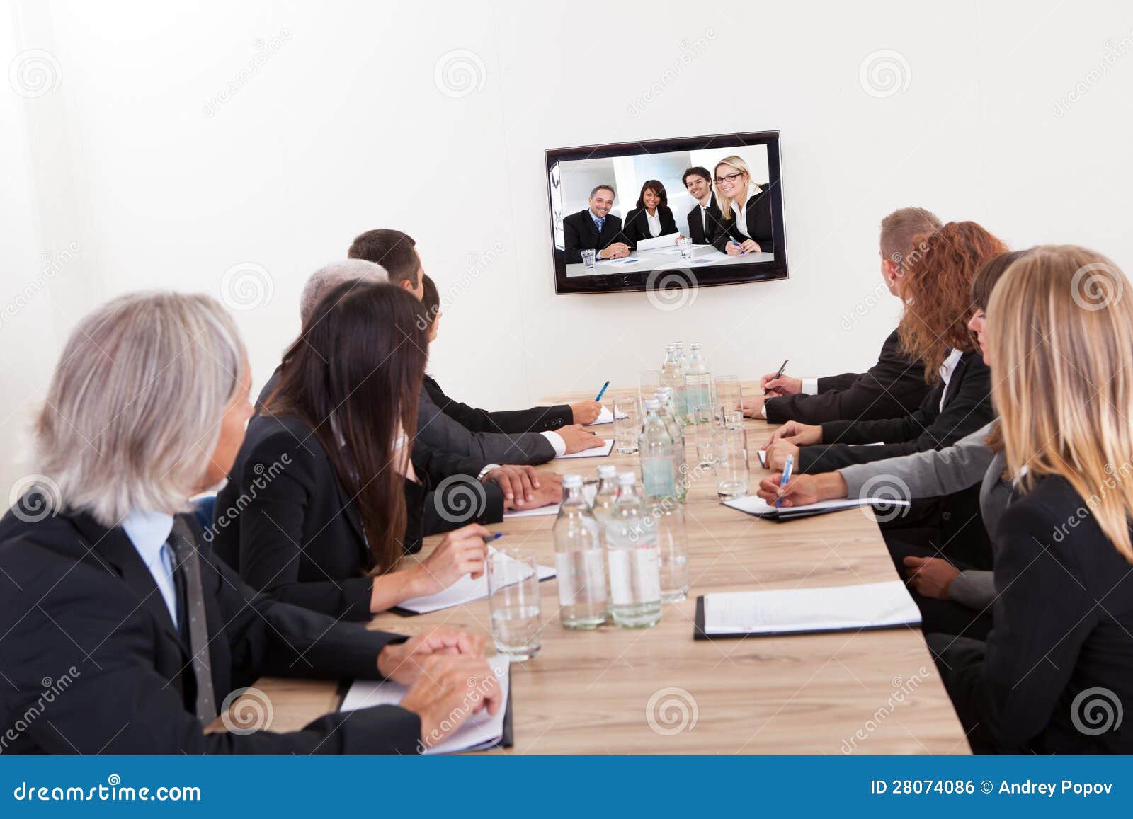 Businesspeople Sitting at Conference Table Stock Photo - Image of ...