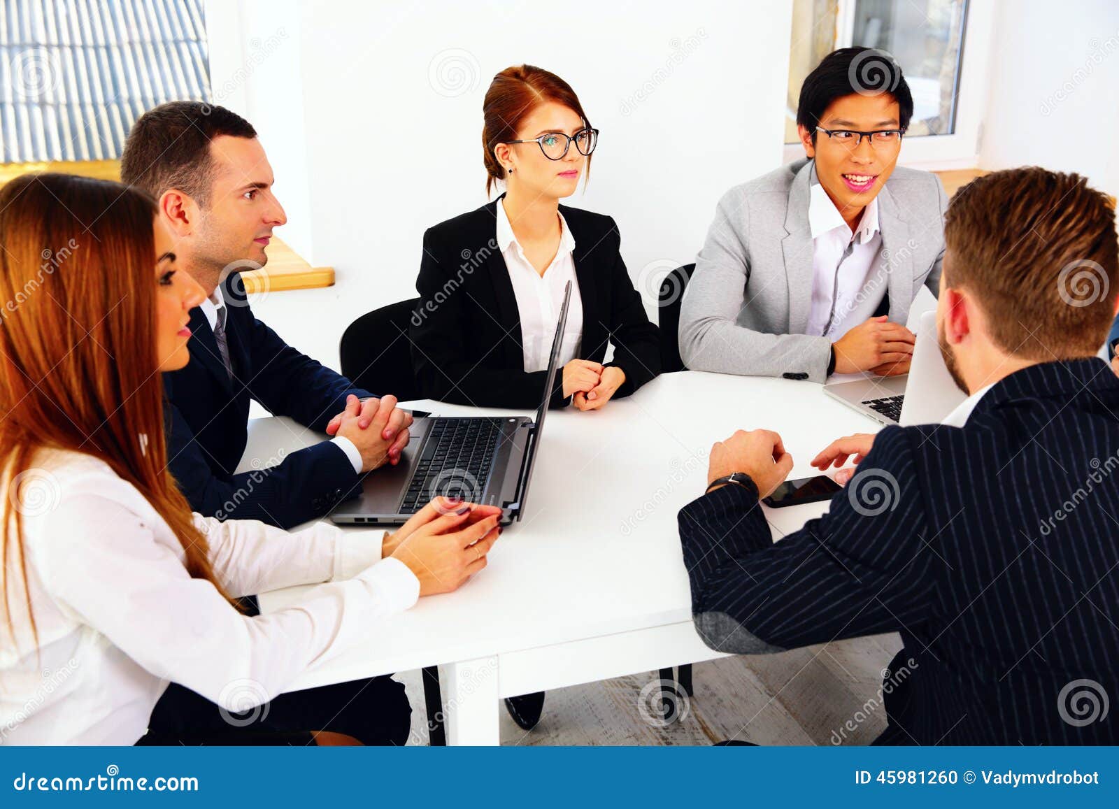 Businesspeople Sitting at the Table Stock Photo - Image of explaining ...