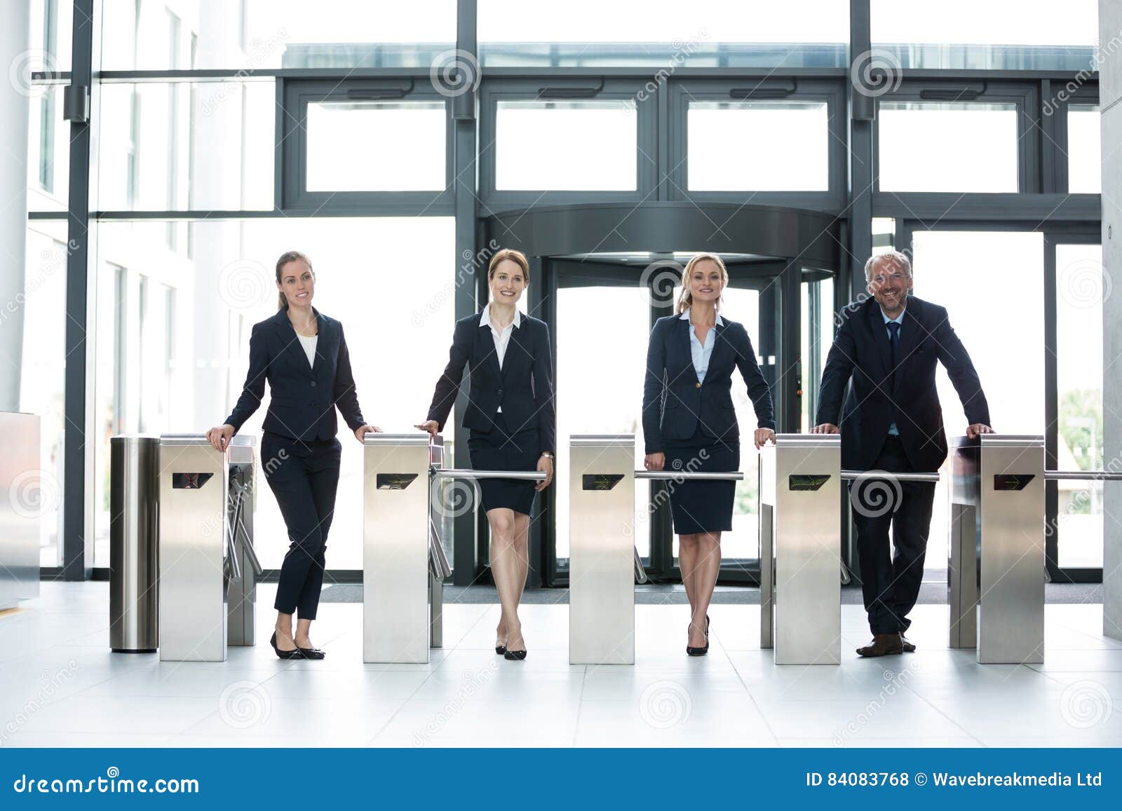 Businesspeople Standing at Turnstile Gate Stock Photo - Image of ...