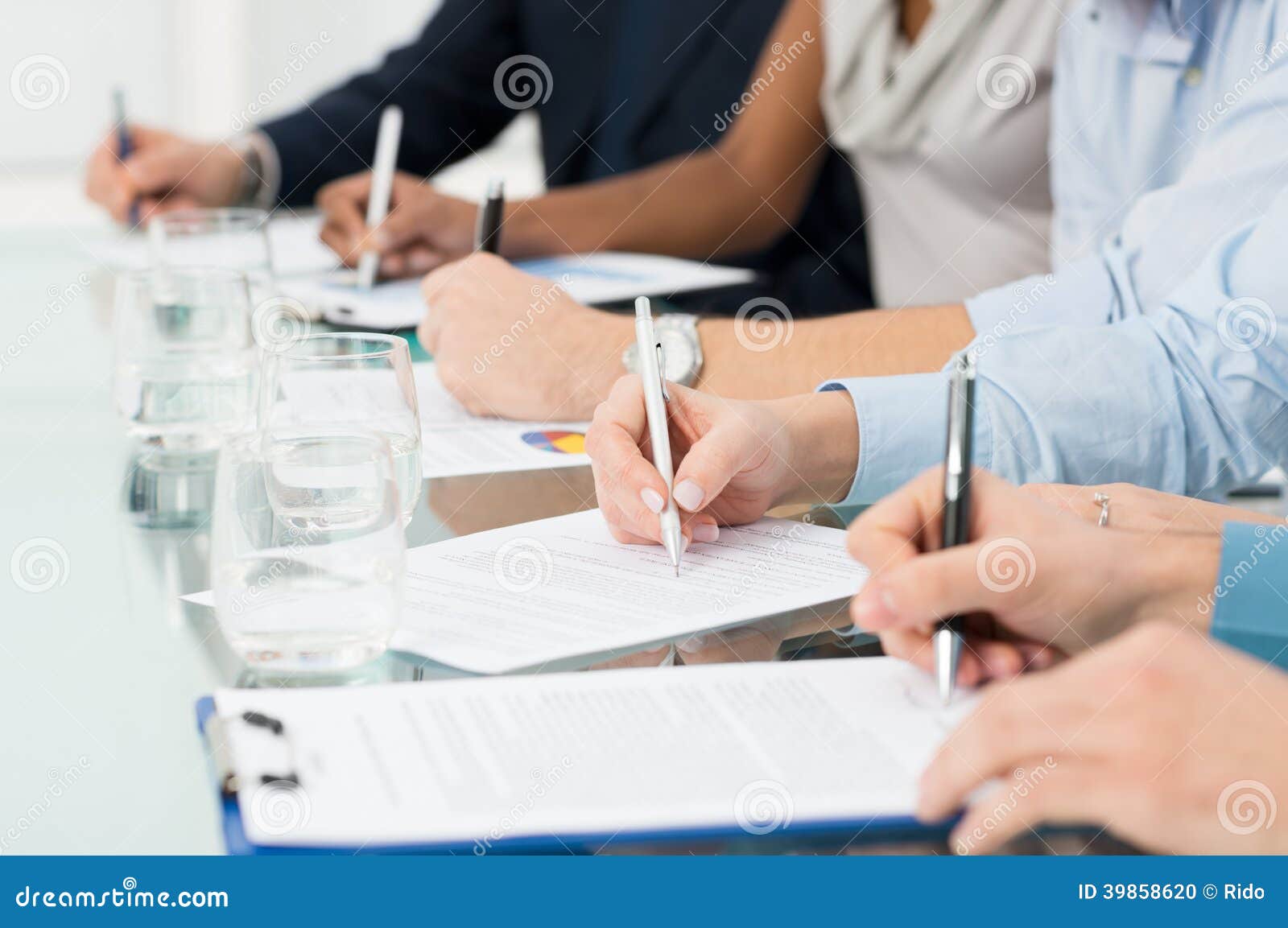 Businesspeople Taking Notes Stock Photo - Image of businesspeople ...
