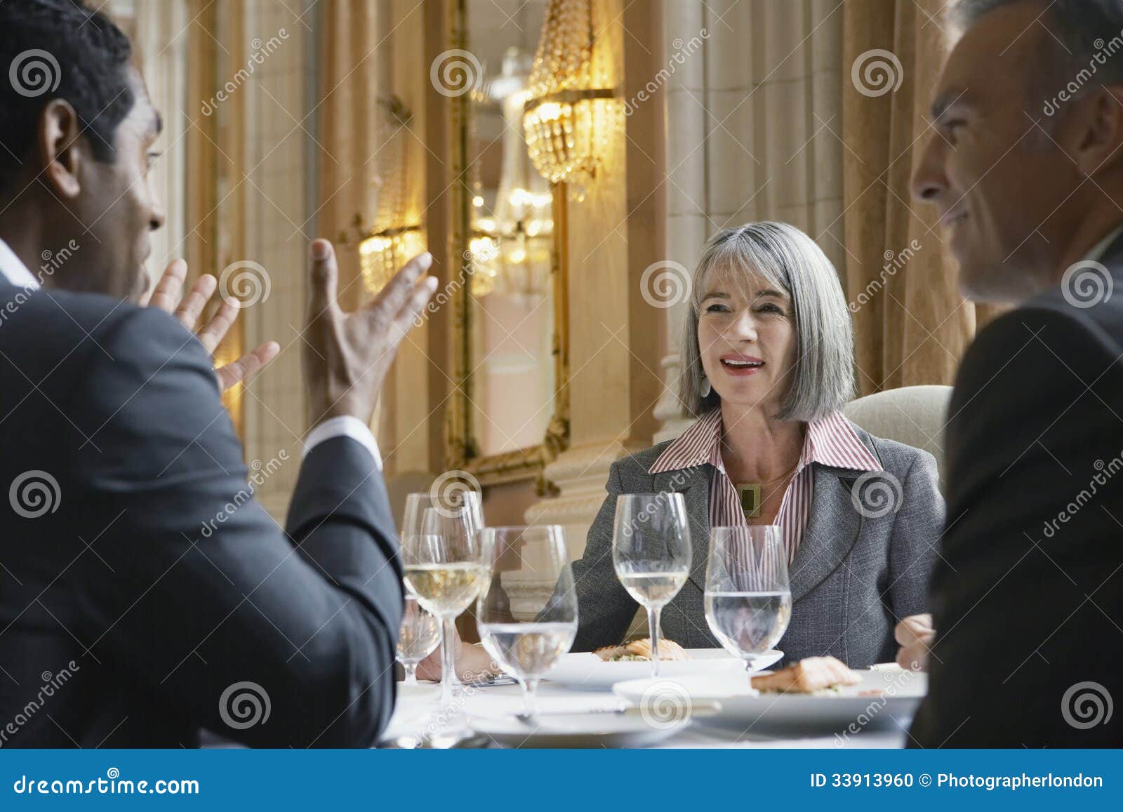 Businesspeople Talking at Restaurant Table Stock Photo - Image of focus ...