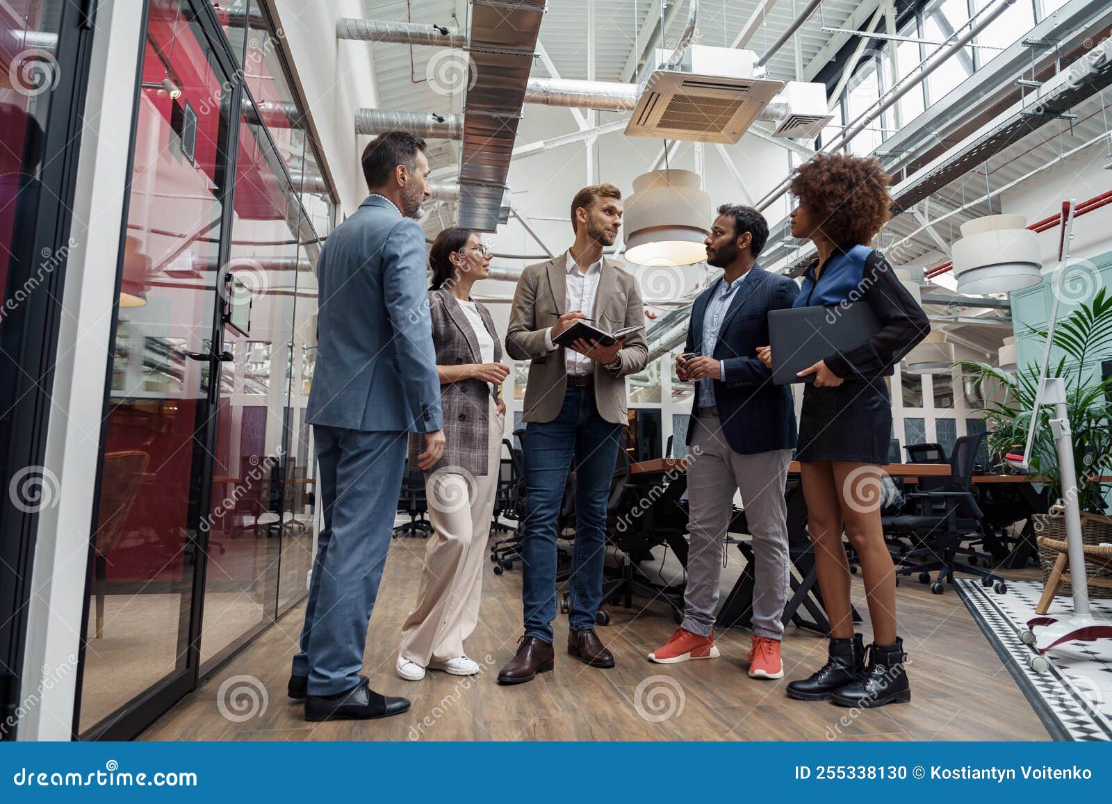 Multiethnic Group of Business People Talking in Office during Break ... Multiethnic Group of Business People Talking in Office during Break ...