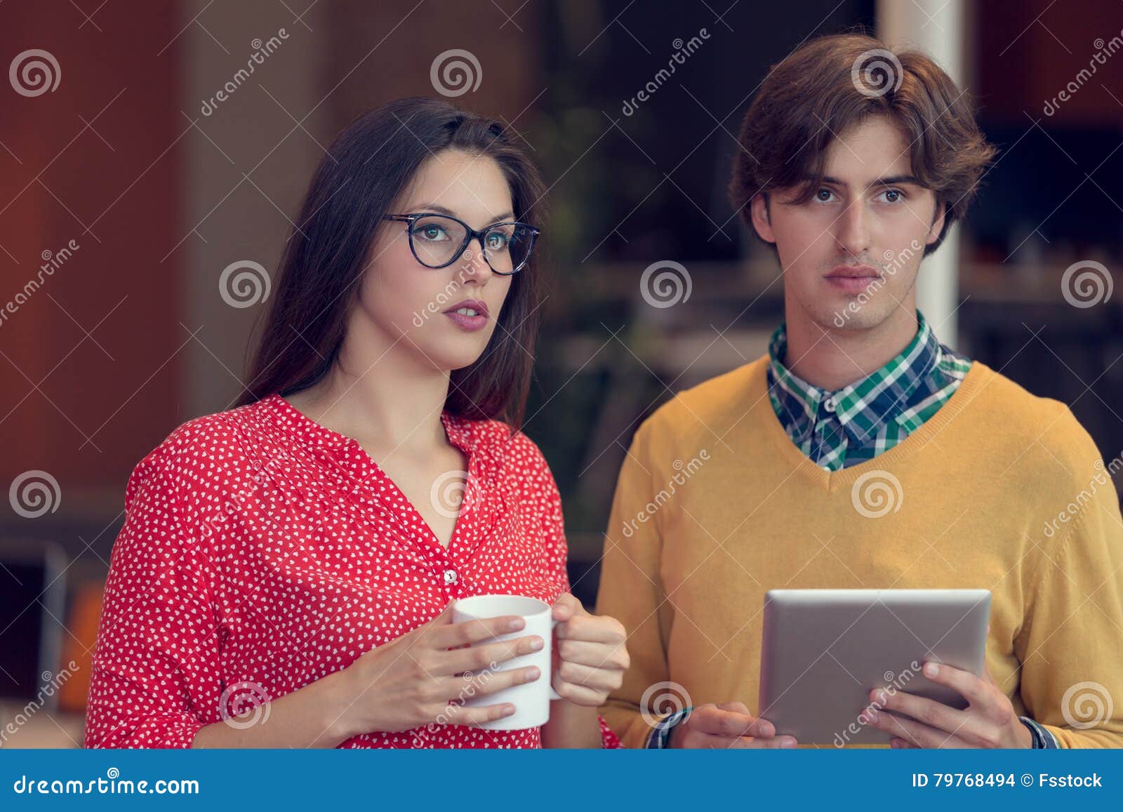Businesspeople Using Tablet Computer, Talking in Office. Stock Photo ...
