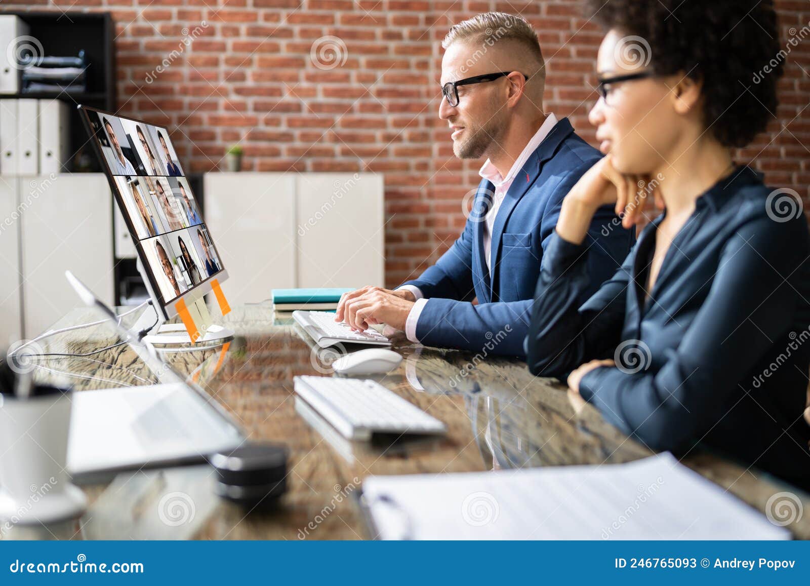 Businesspeople Video Conferencing with Their Partner on Computer Stock ...