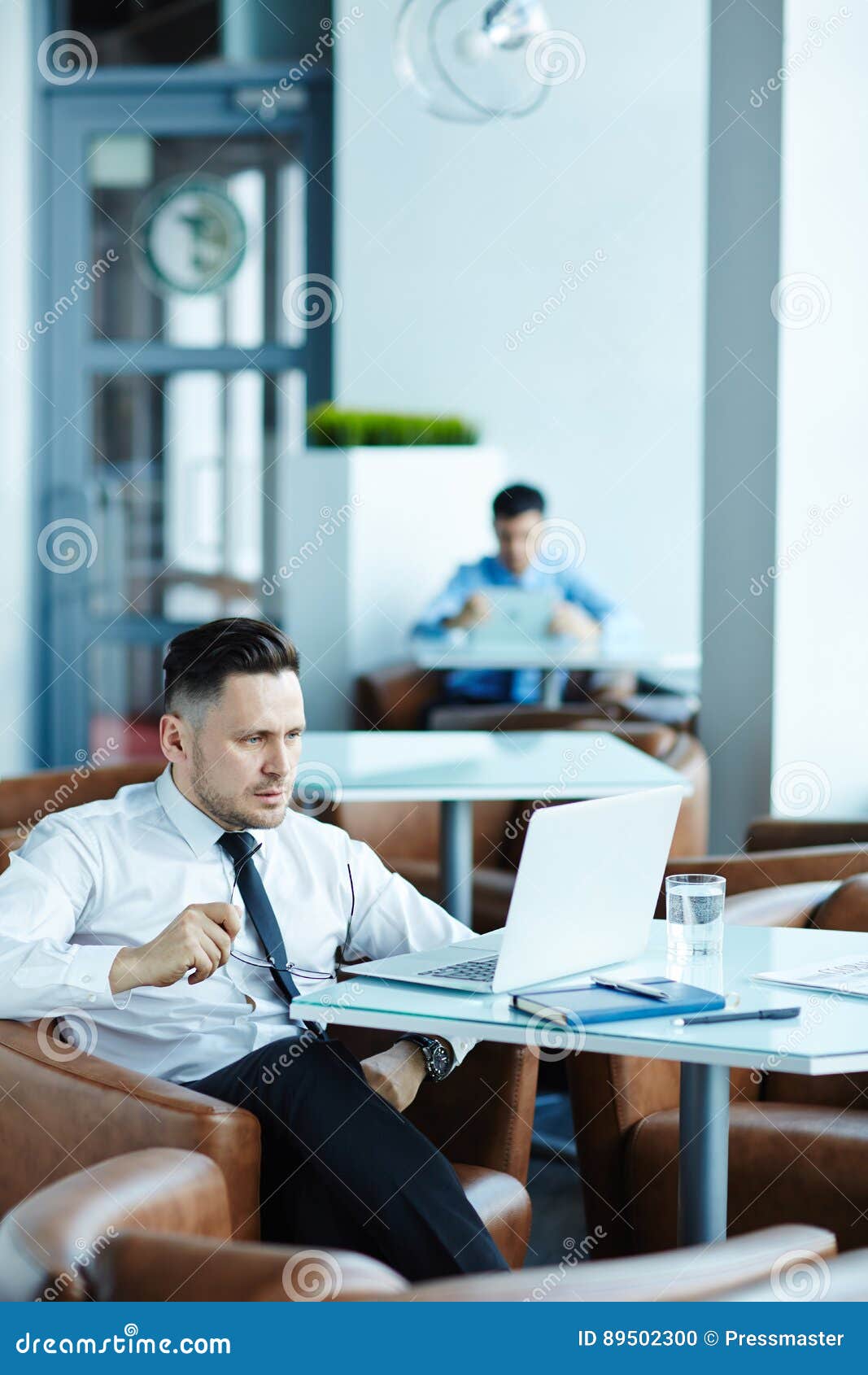 Businesspeople Working in Cyber Cafe Stock Photo - Image of ...