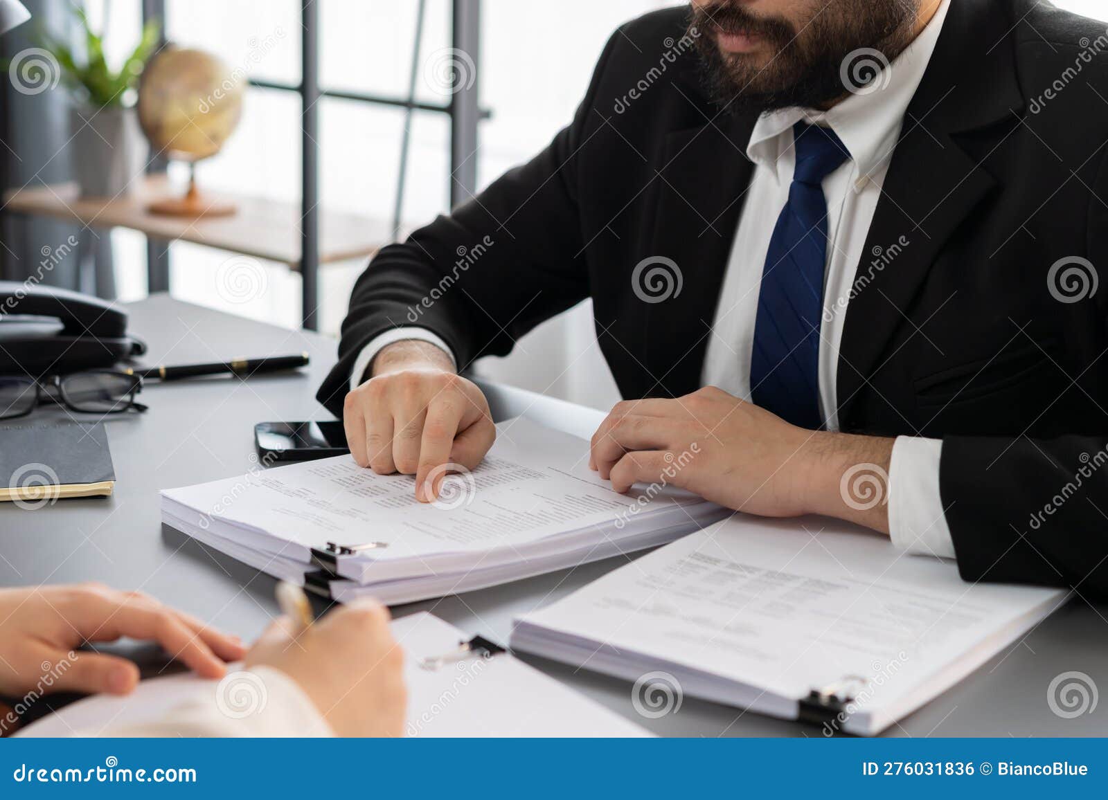 Businesspeople Working in the Office on Official Corporate Papers ...