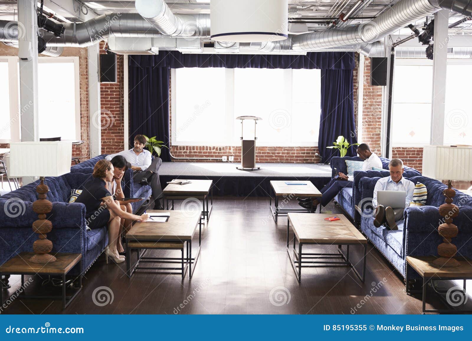 Businesspeople Working in Relaxation Area of Modern Office Stock Image ...