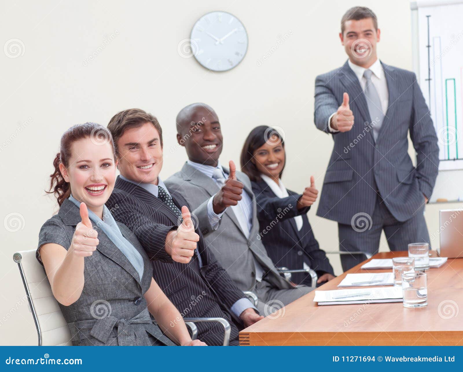 Businessteam with Thumbs Up after a Presentation Stock Photo - Image of ...