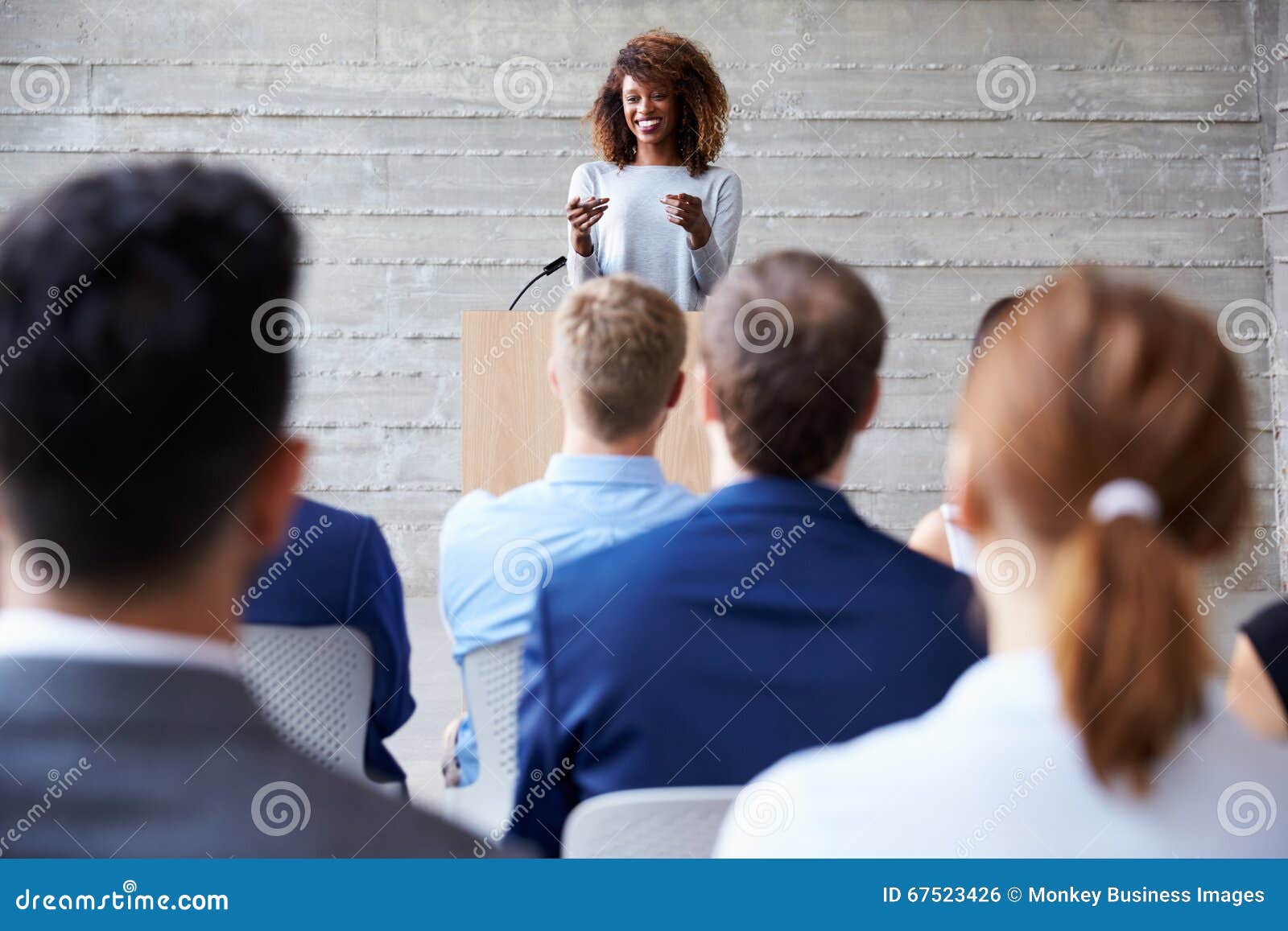 Businesswoman Addressing Delegates at Conference Stock Photo - Image of ...
