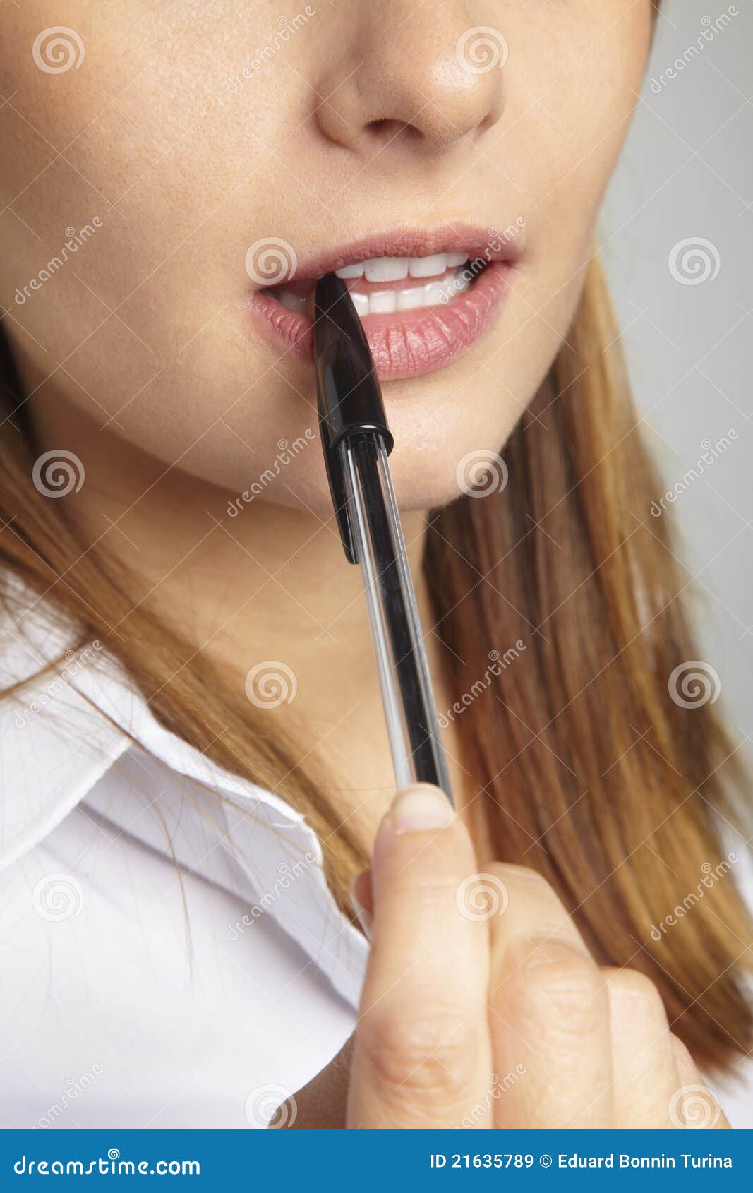 Businesswoman bitting pen stock image. Image of business - 21635789