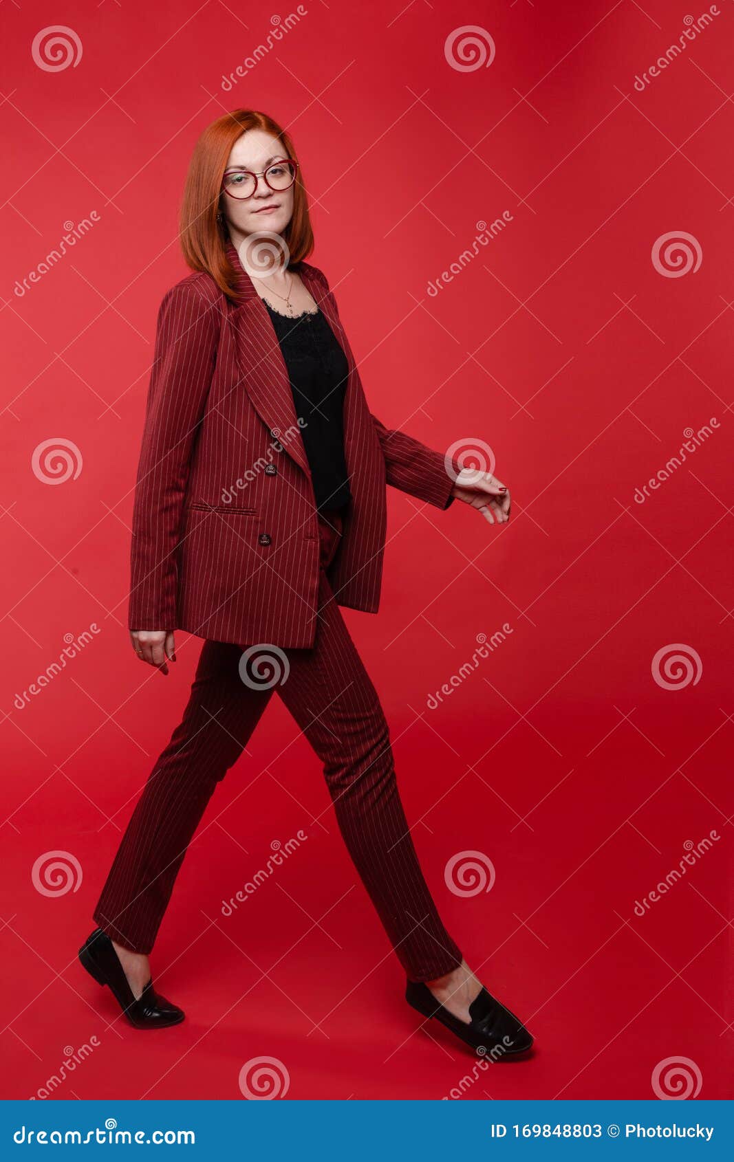 Businesswoman In Black Suit And Shoes On Red Stock Image Image Of