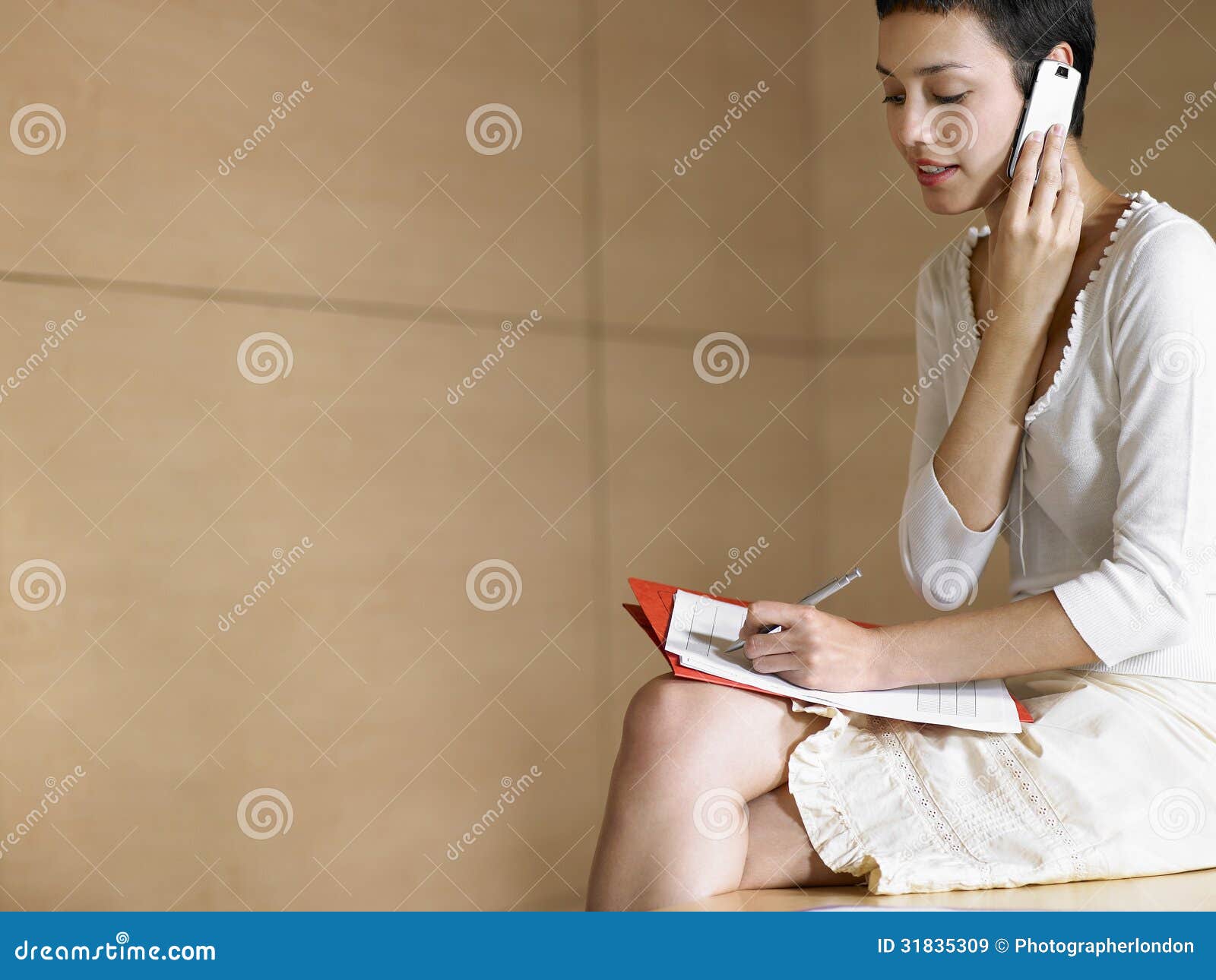 Businesswoman on Call Taking Notes Stock Image - Image of preparing ...