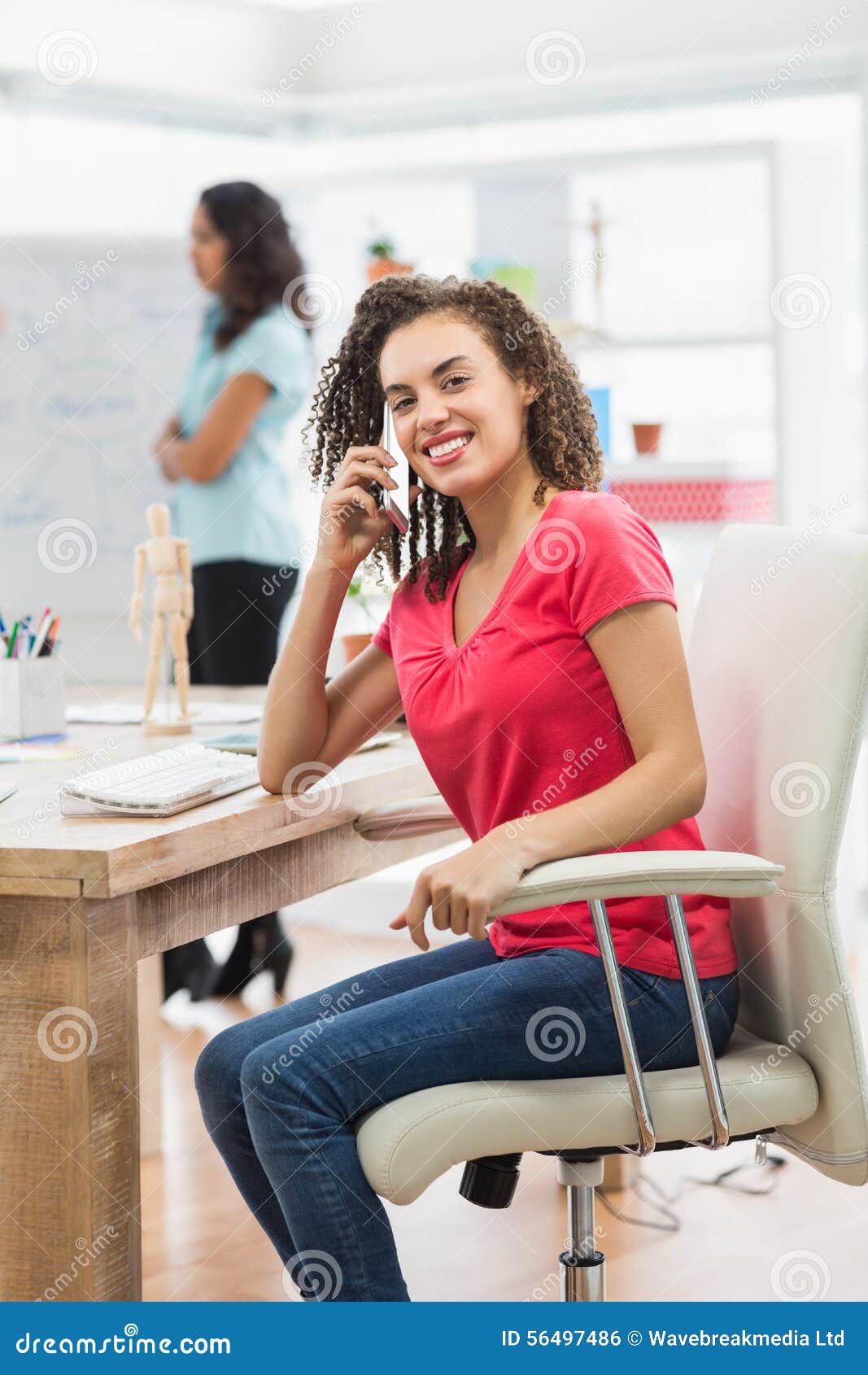 Businesswoman Calling Someone at Her Desk Stock Photo - Image of ...