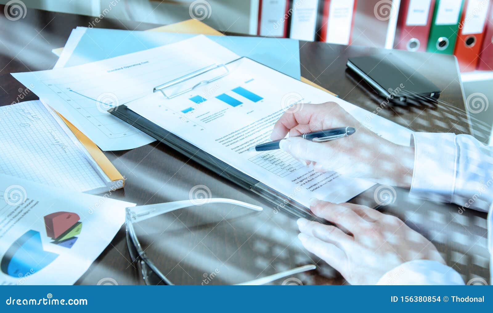 Businesswoman Checking a Report; Light Effect Stock Photo - Image of ...