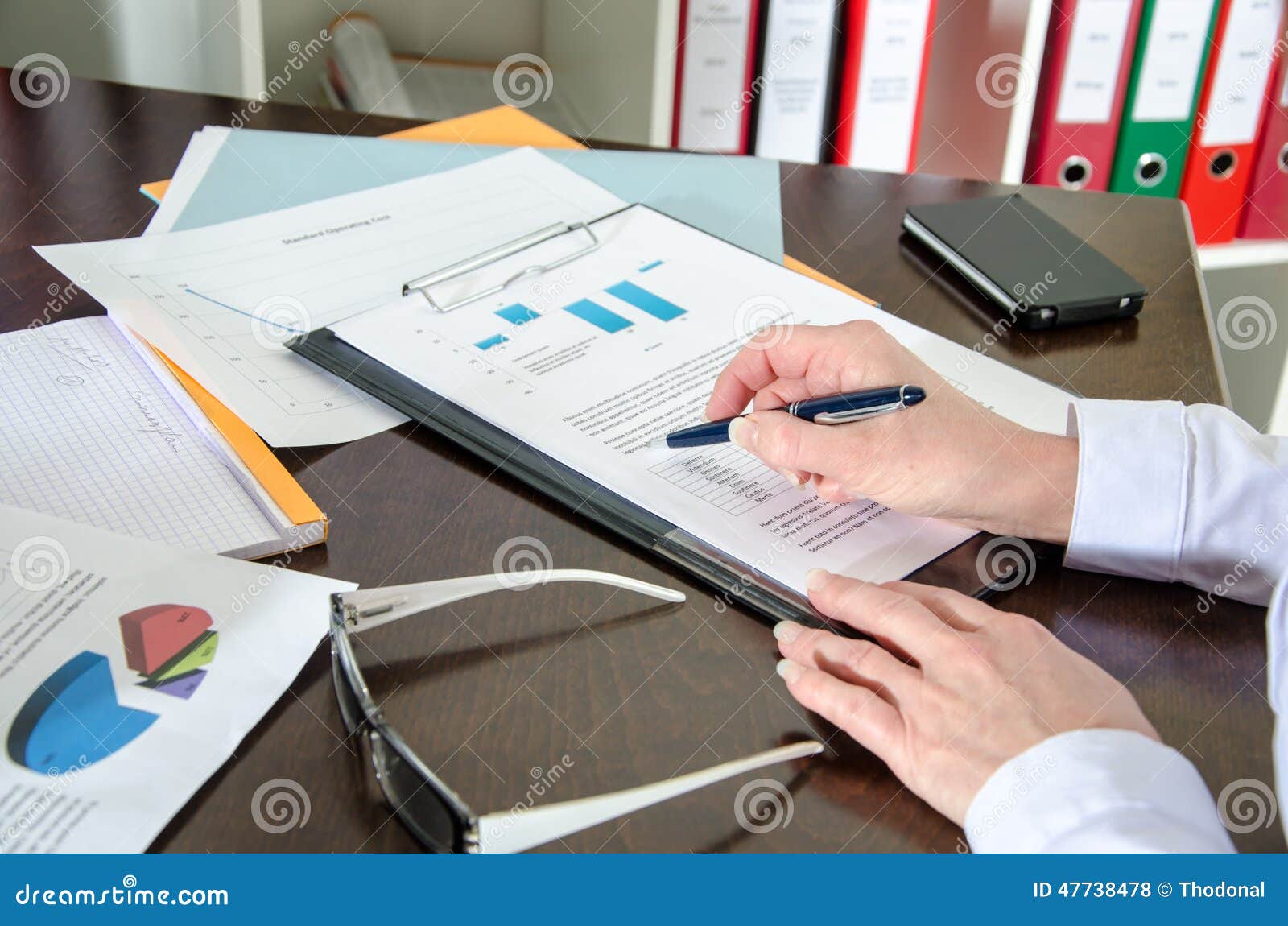 Businesswoman Checking a Report Stock Photo - Image of female, manager ...
