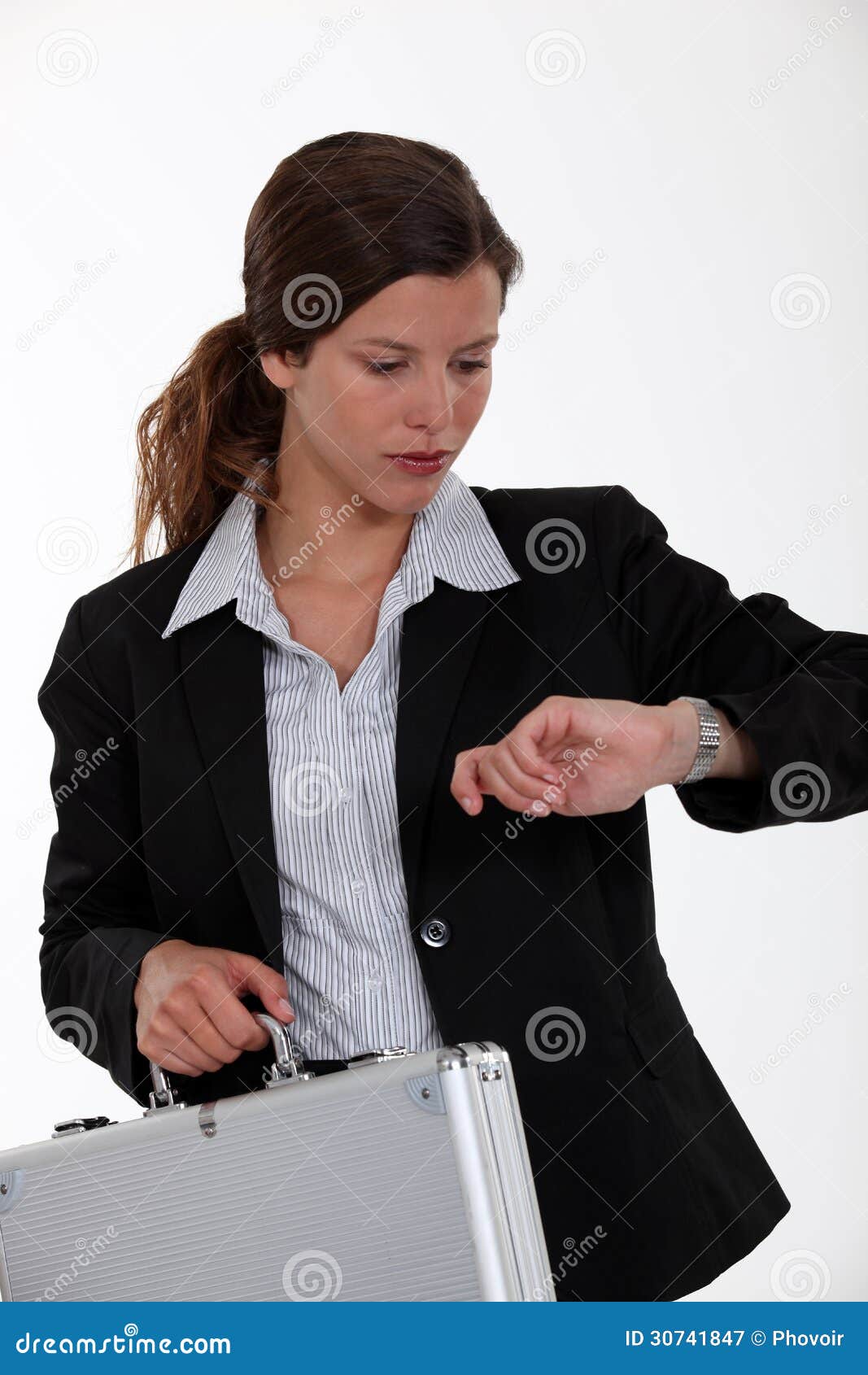 Businesswoman Checking Watch Stock Image - Image of beauty, lady: 30741847