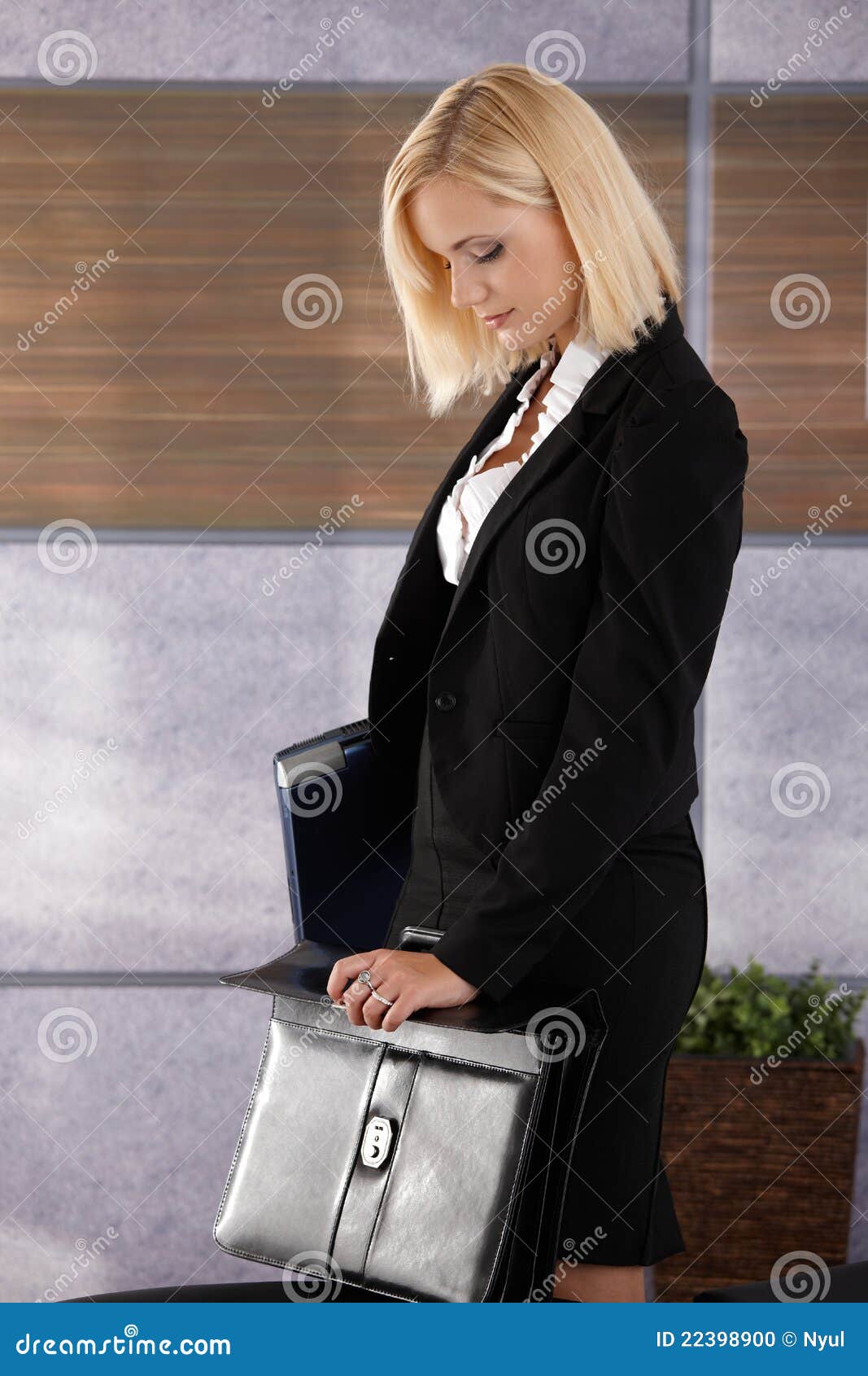 Businesswoman Closing Briefcase Stock Photo - Image of hallway ...