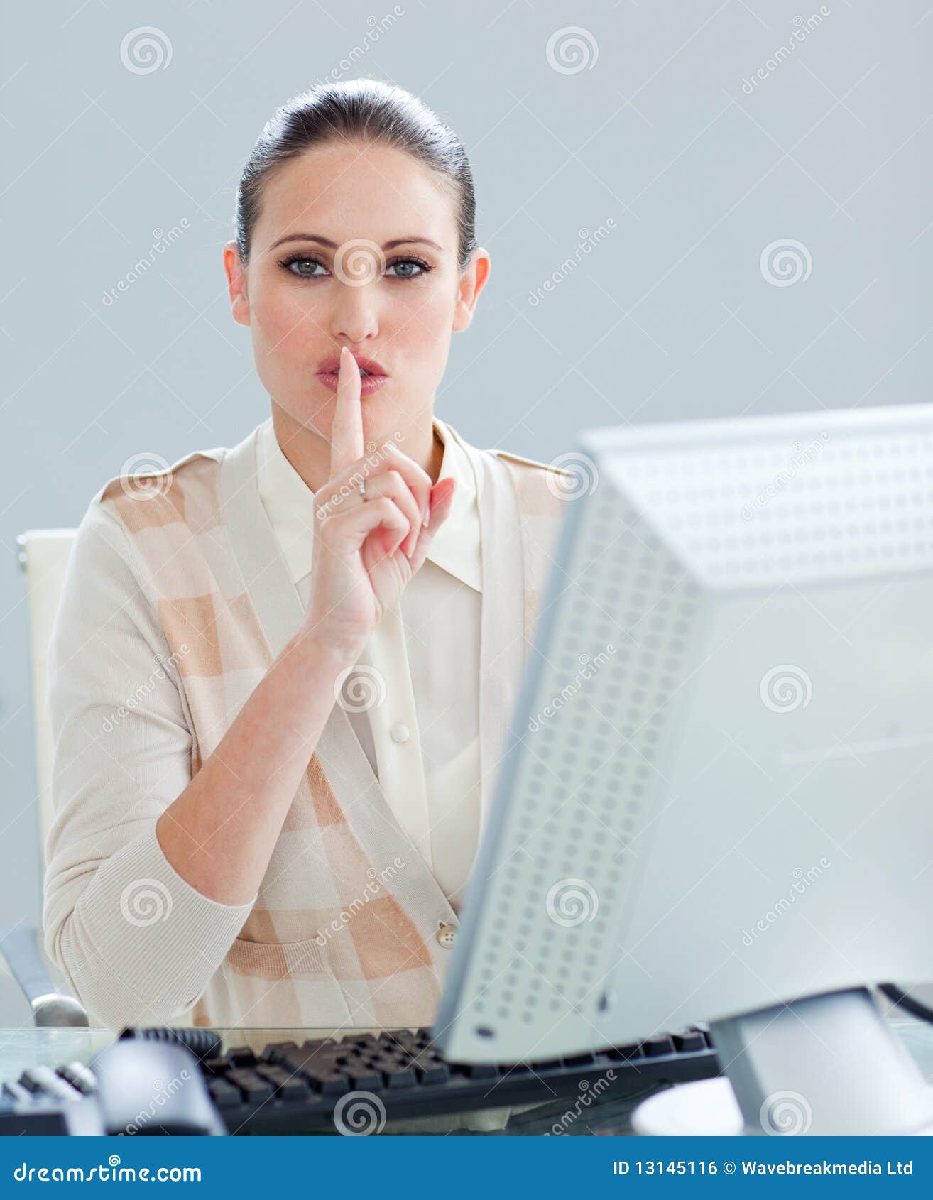 A Businesswoman at a Computer Asking for Silence Stock Photo - Image of ...