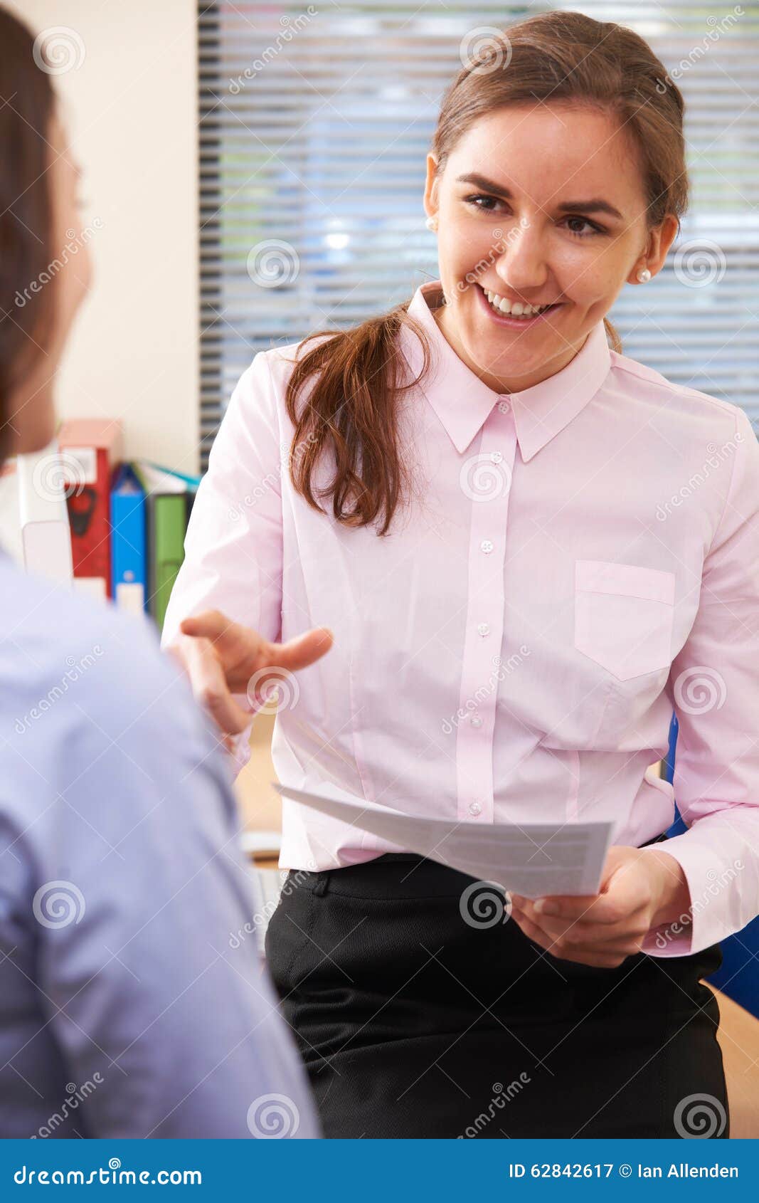 Businesswoman in Conversation with Female Intern Stock Image - Image of ...