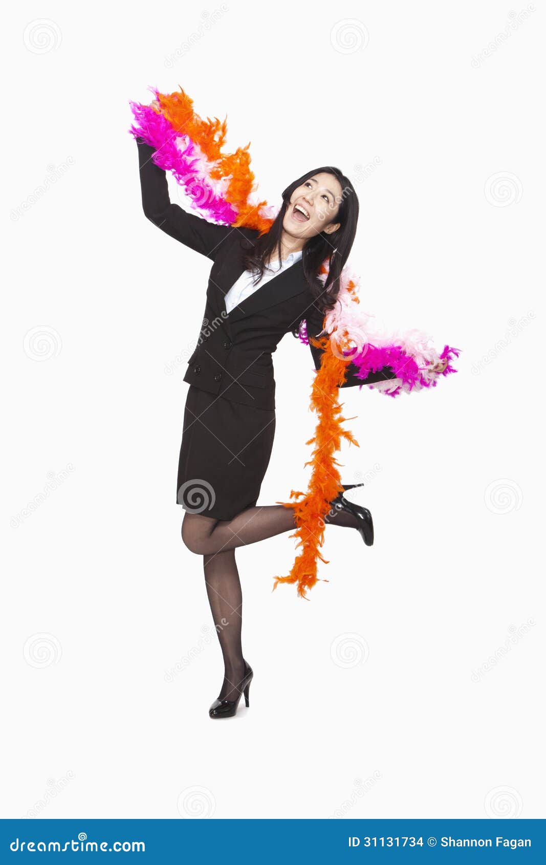 Businesswoman Dancing with Feather Boa, Studio Shot Stock Photo - Image ...