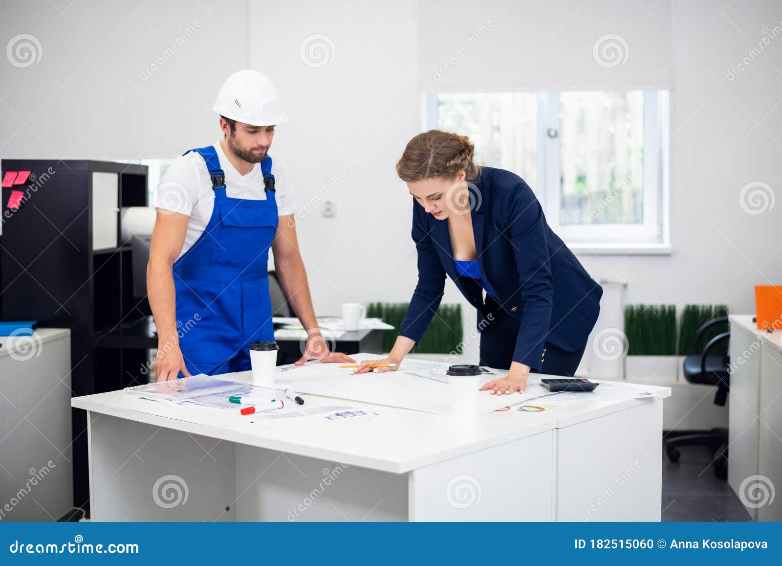 A Businesswoman Discussing the Construction Project with Her Con Stock ...