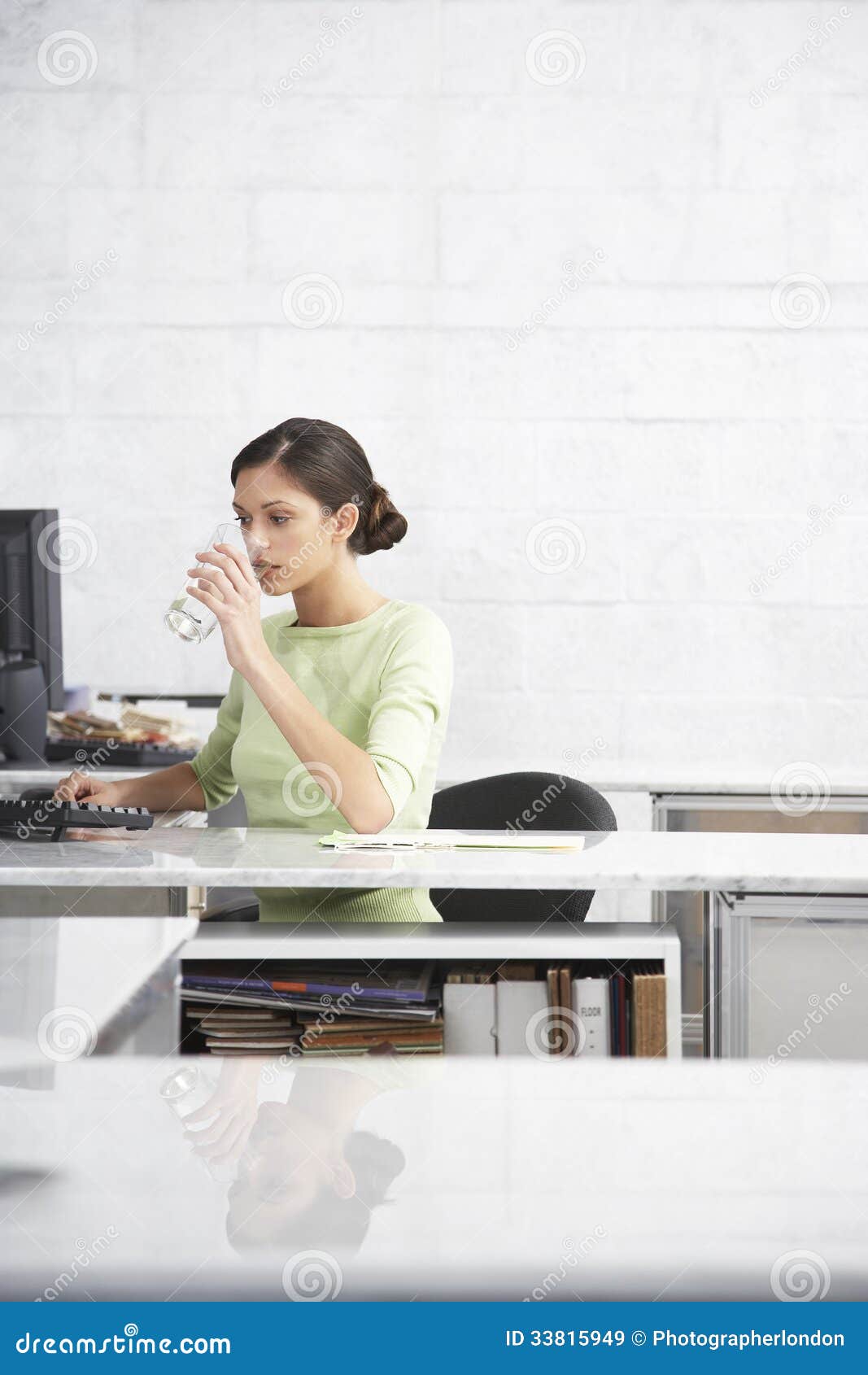 Businesswoman Drinking Water at Computer Desk Stock Image - Image of ...