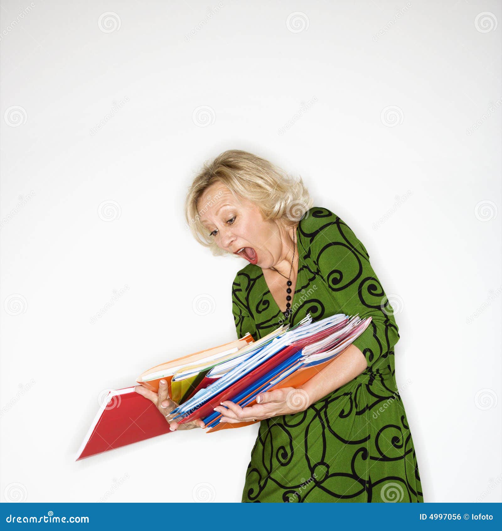 Businesswoman Dropping Folders Stock Photo - Image of expression ...