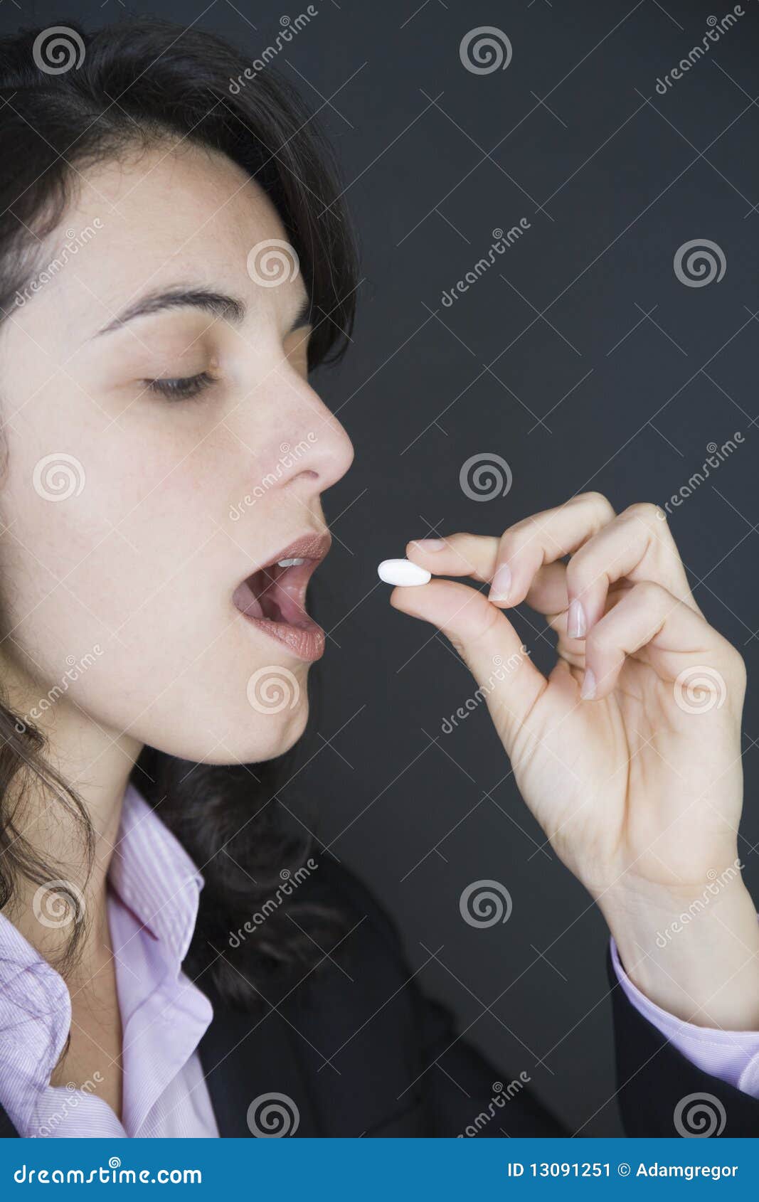 Businesswoman Eating a Pill Stock Image - Image of medicine, drug: 13091251