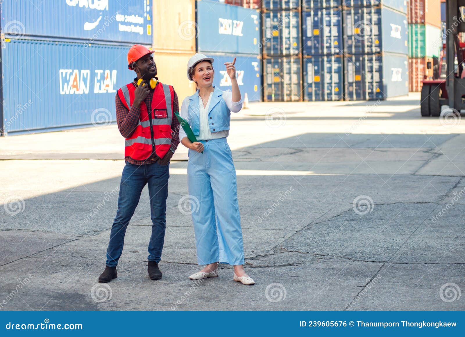 Businesswoman and Engineer Talking and Checking Loading Containers Box ...