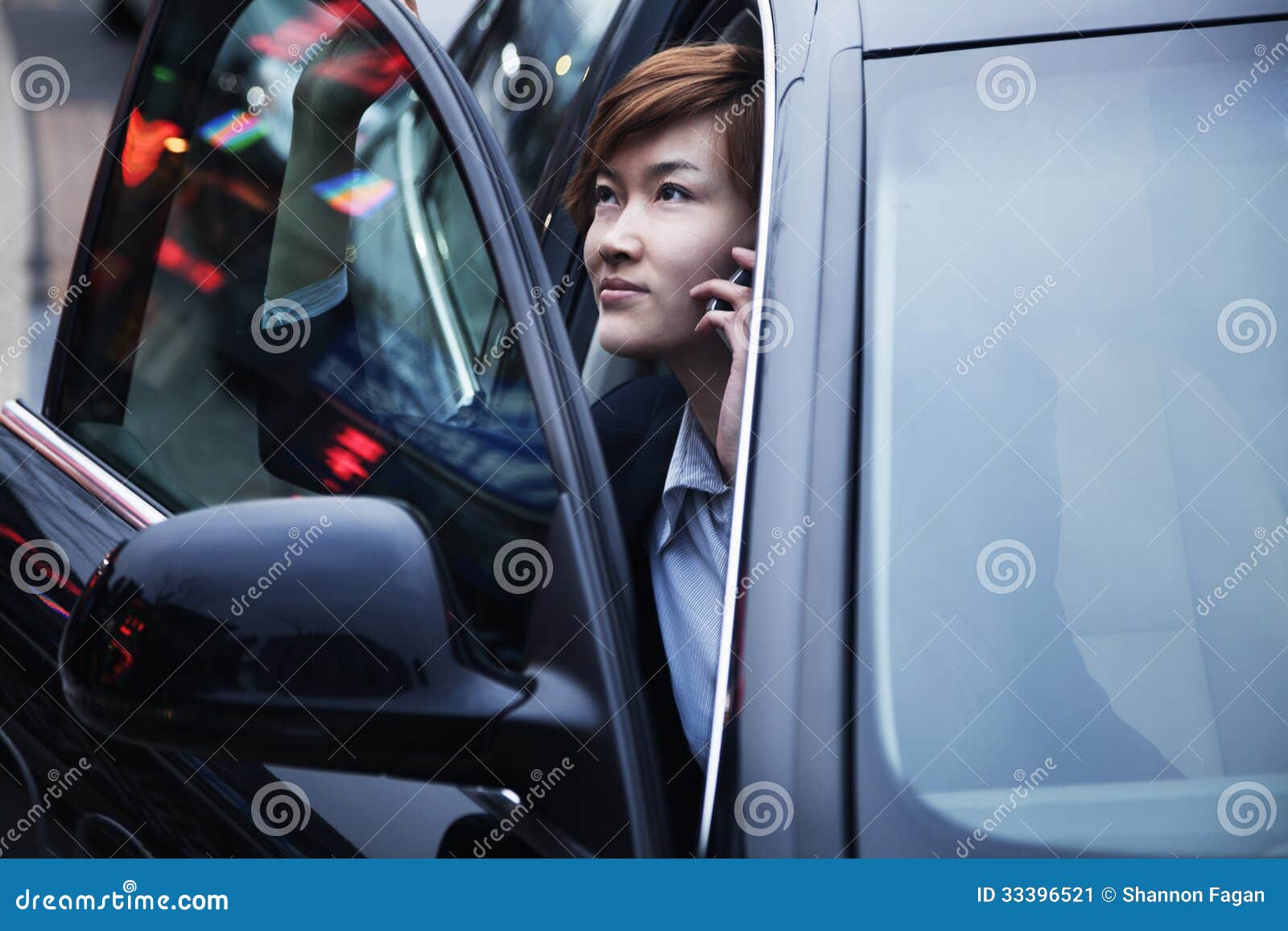 Businesswoman Exiting Car while on the Phone Stock Image - Image of ...