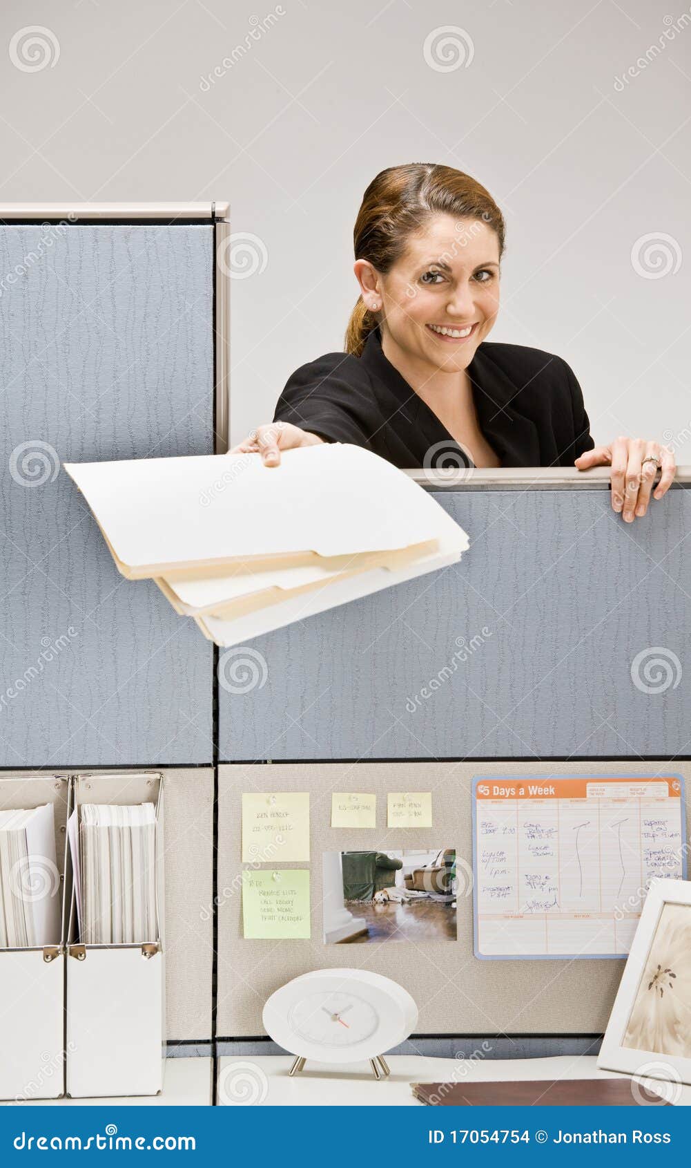 Businesswoman Handing Co-worker File Folder Stock Photo - Image of ...
