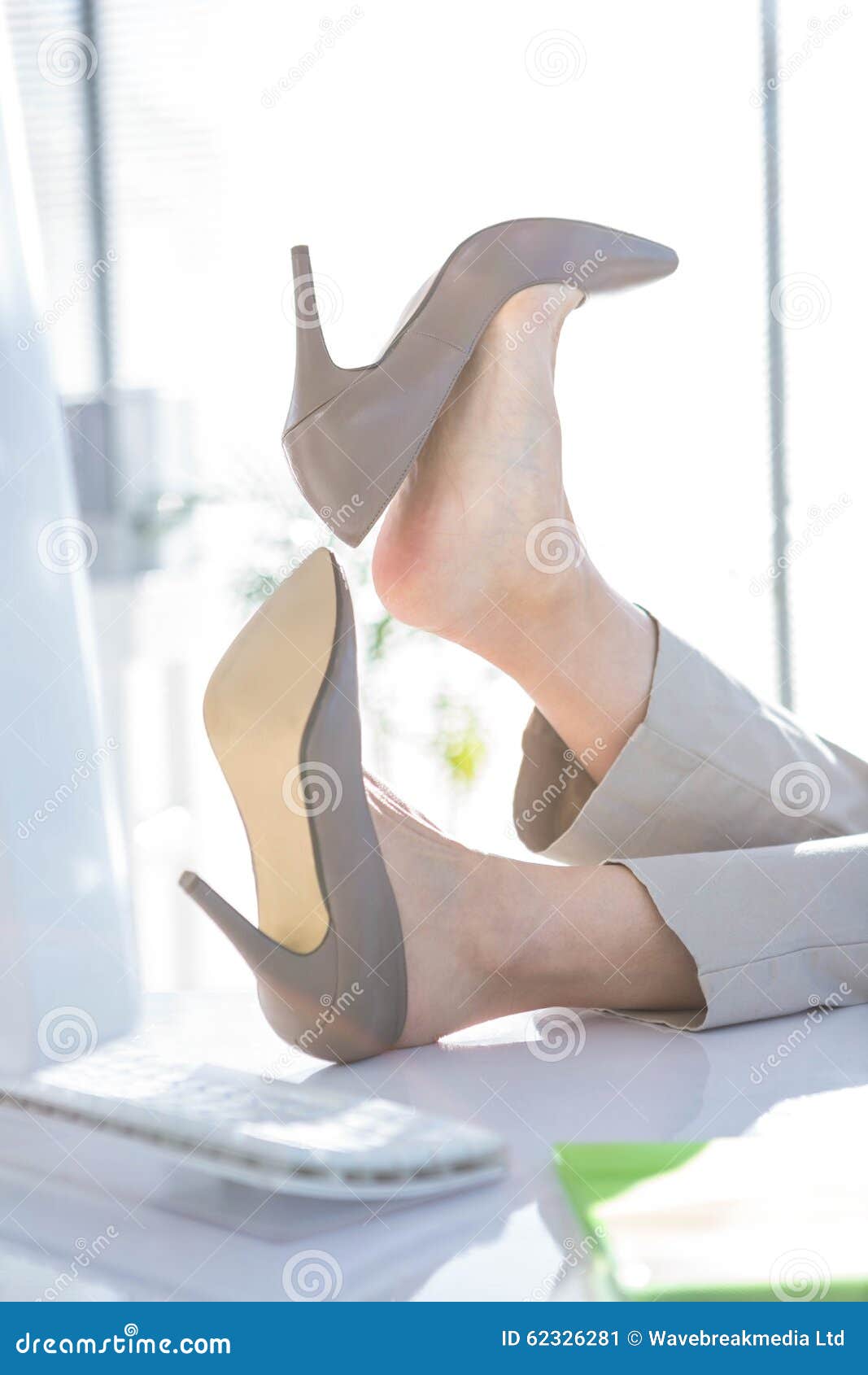 Businesswoman with Her Legs on Her Desk Stock Image - Image of smiling ...
