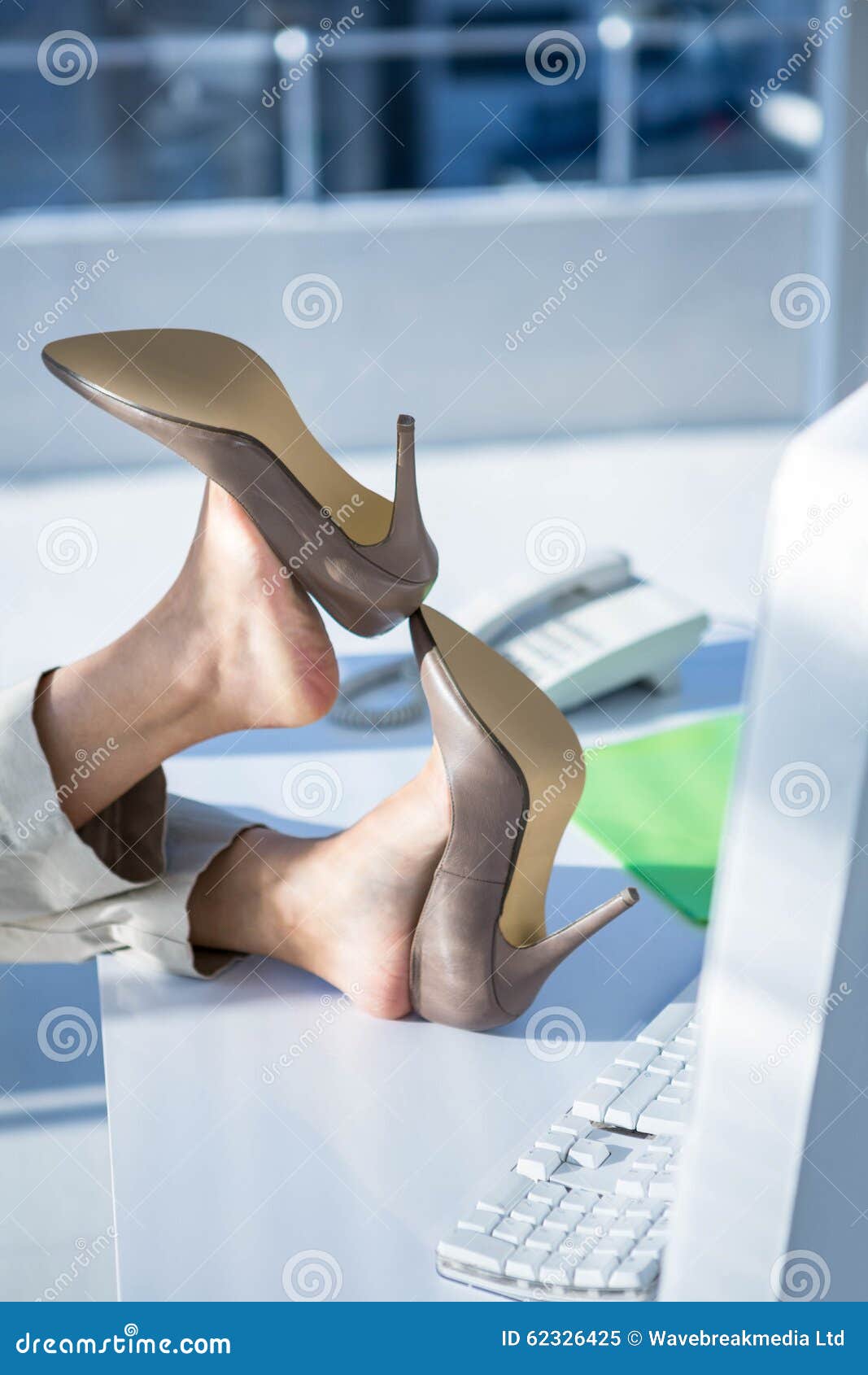 Businesswoman with Her Legs on Her Desk Stock Image - Image of ...