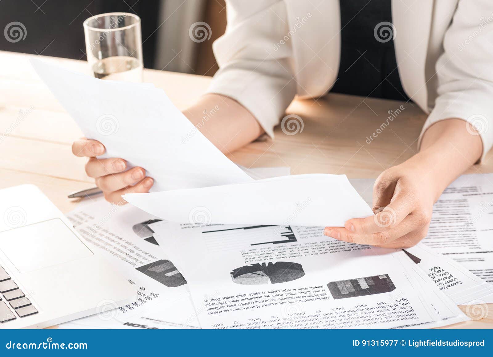 Businesswoman Holding Contract Documents Sitting at Table Stock Image ...