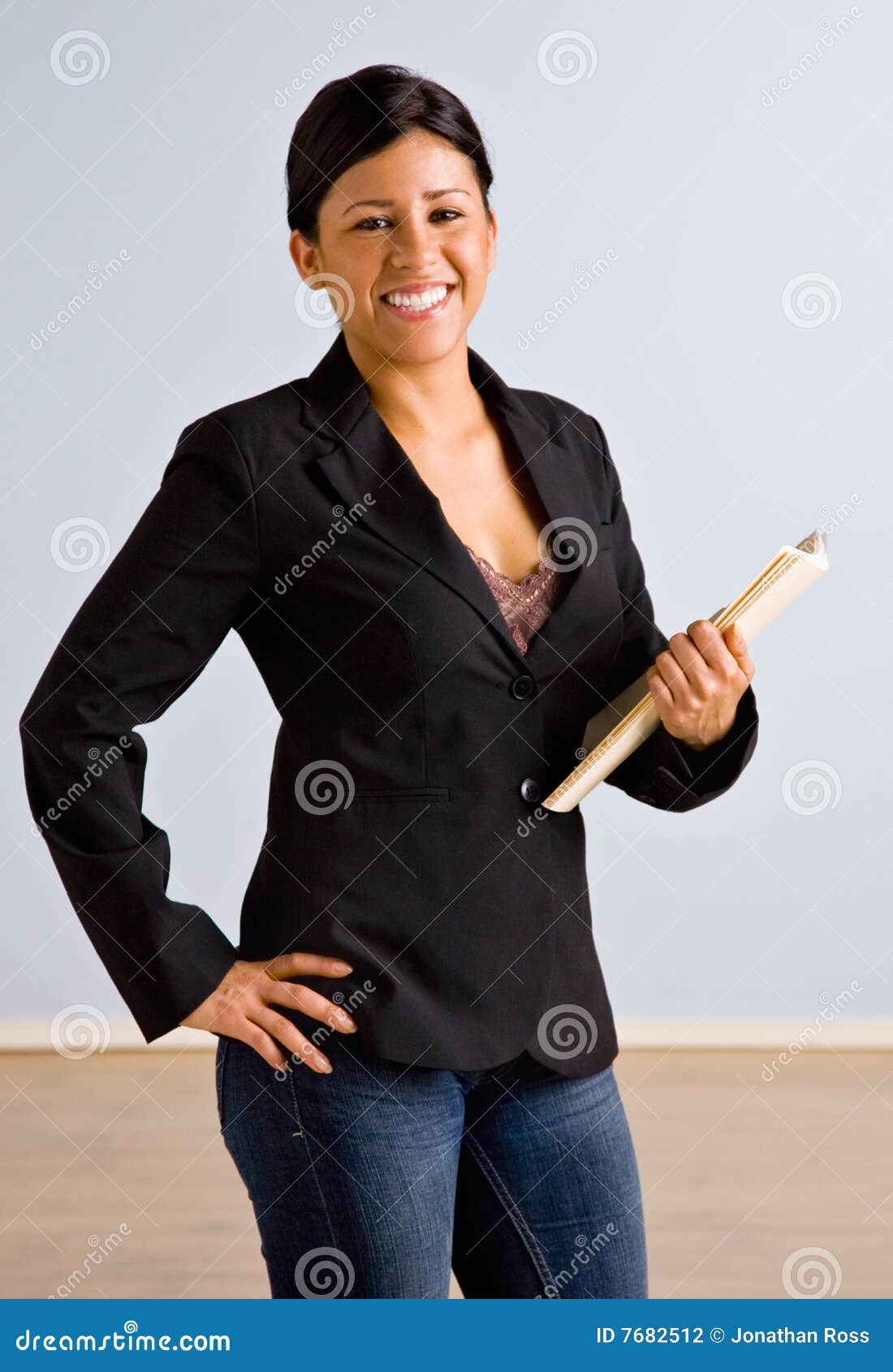 Businesswoman Holding File Folders Stock Photo - Image of person, jeans ...