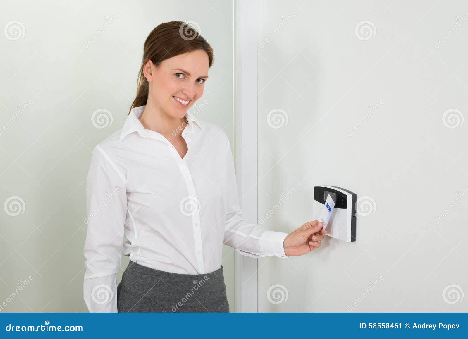 Businesswoman Inserting Keycard in Security System Stock Image - Image ...