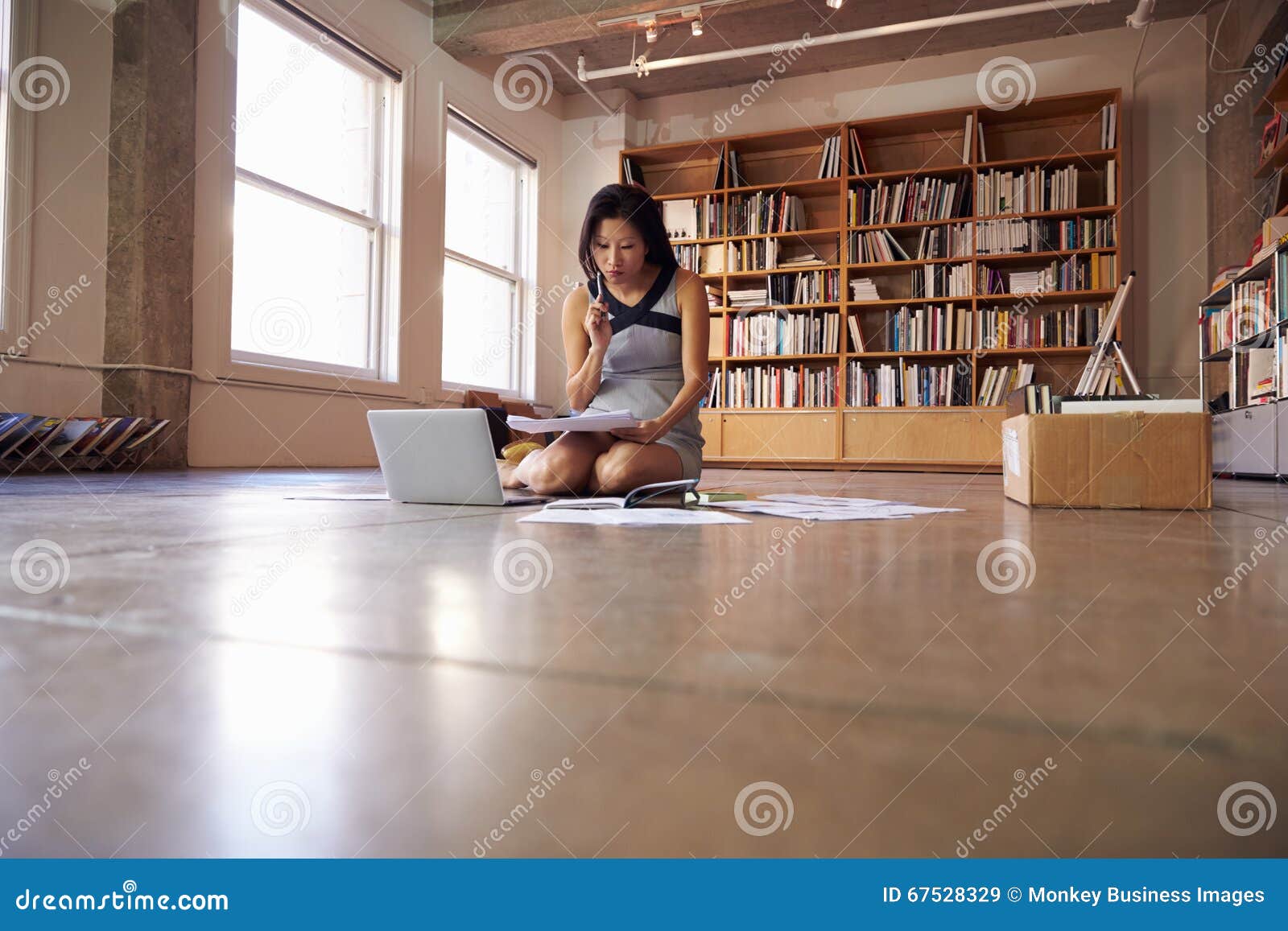Businesswoman Laying Documents on Floor To Plan Project Stock Image ...
