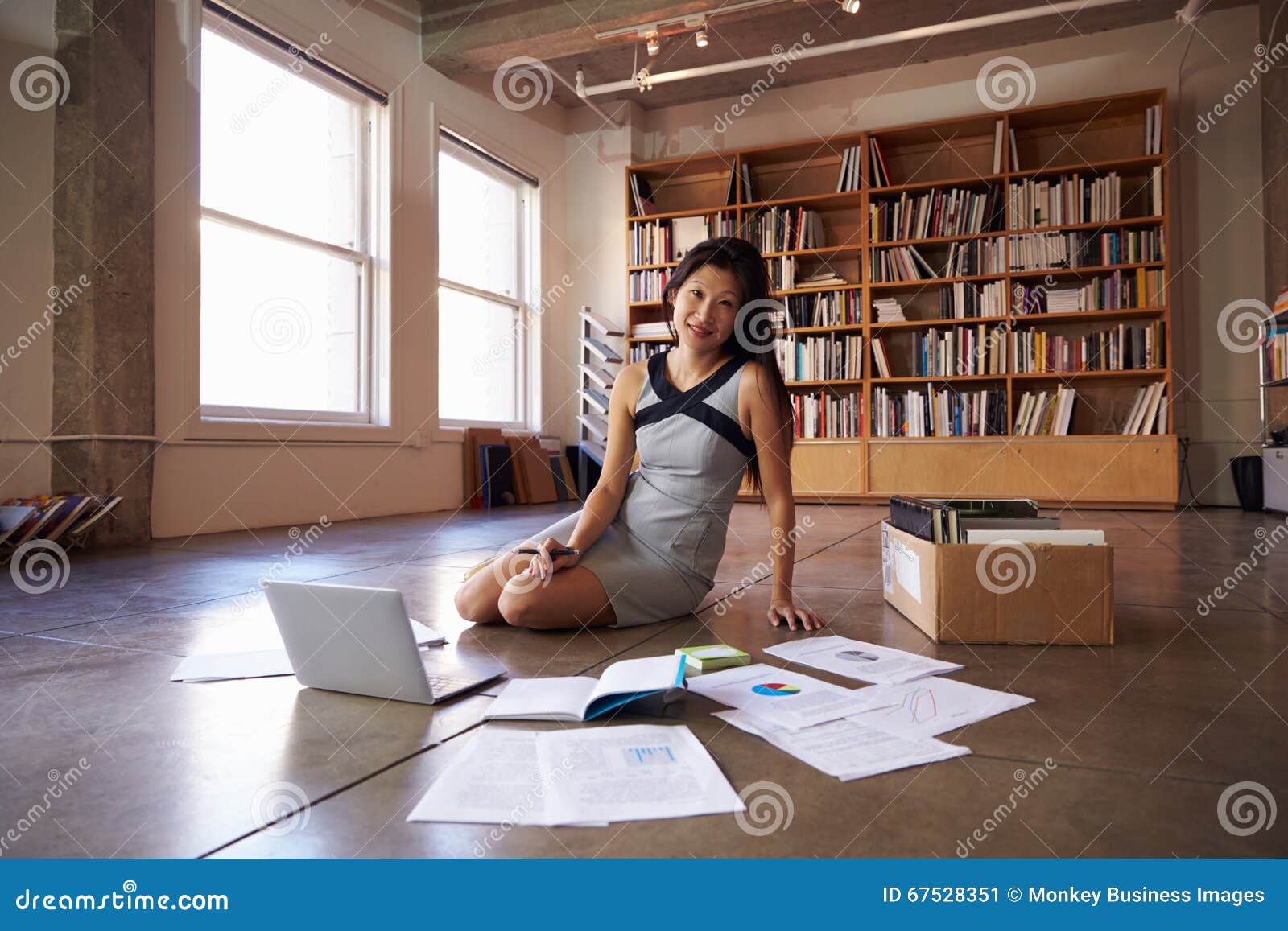 Businesswoman Laying Documents on Floor To Plan Project Stock Image ...